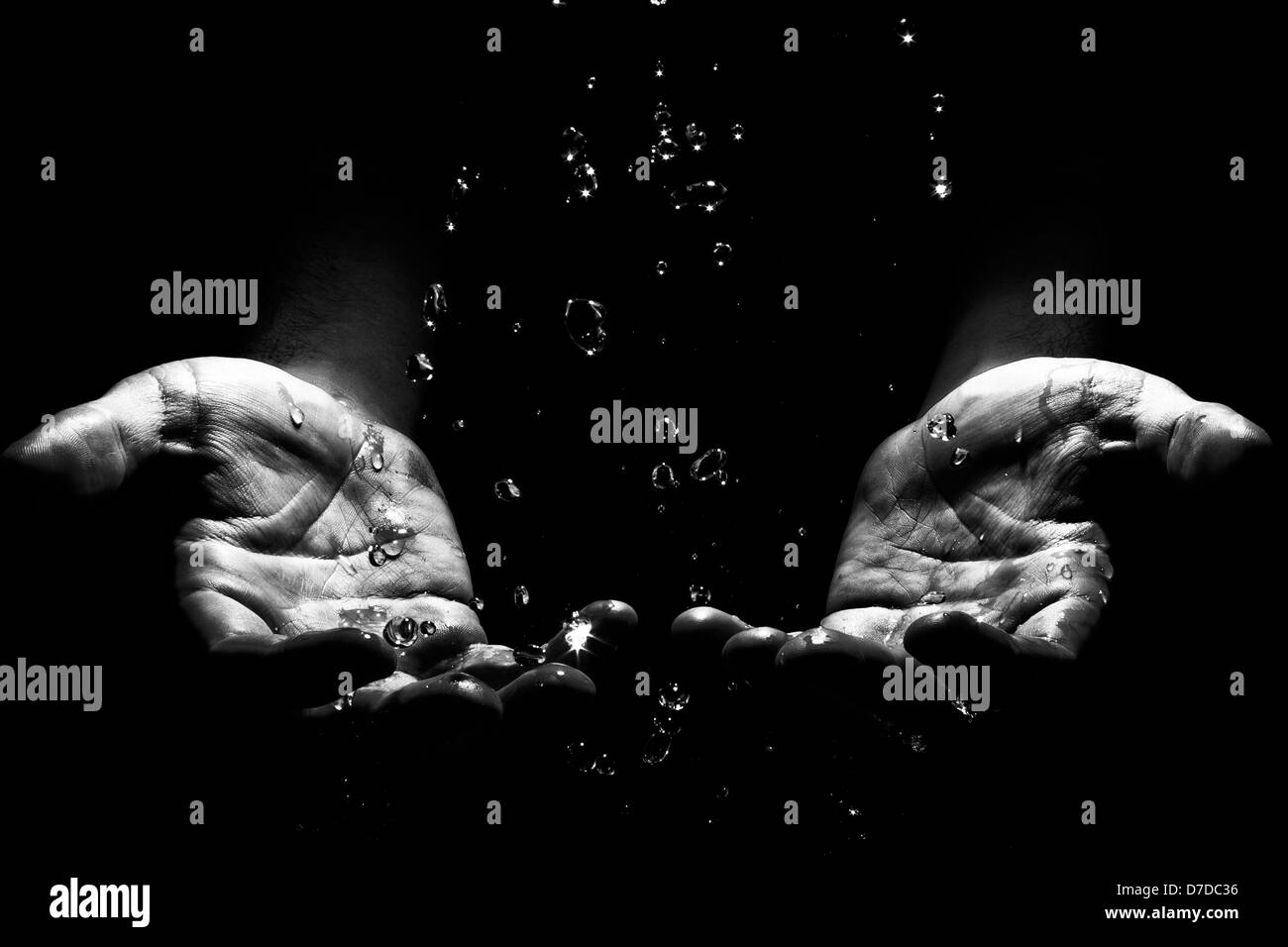 A pair of hands catching water droplets Stock Photo - Alamy