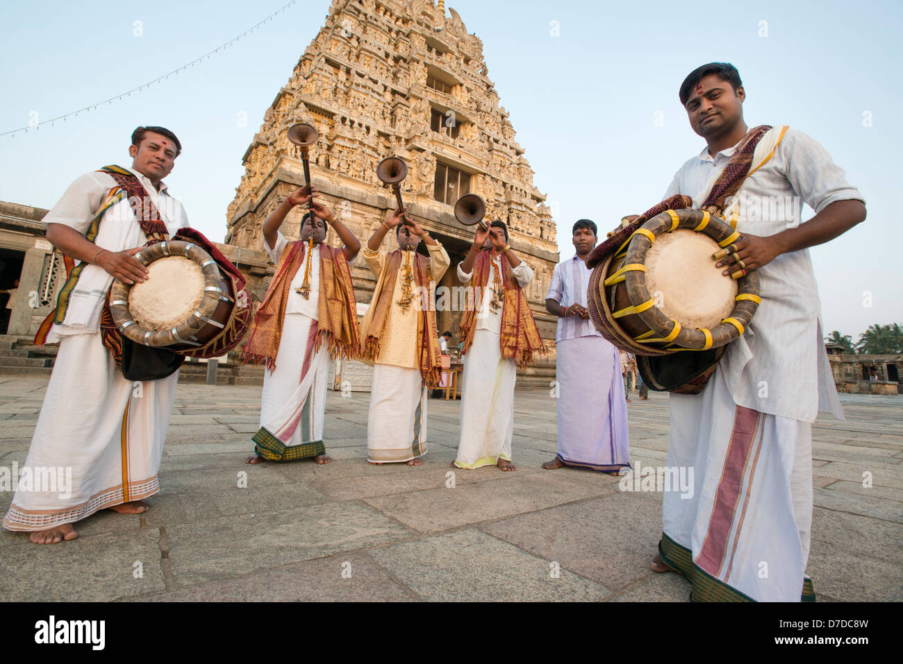 A group of Hindu temple musicians pose for the camera at the ...
