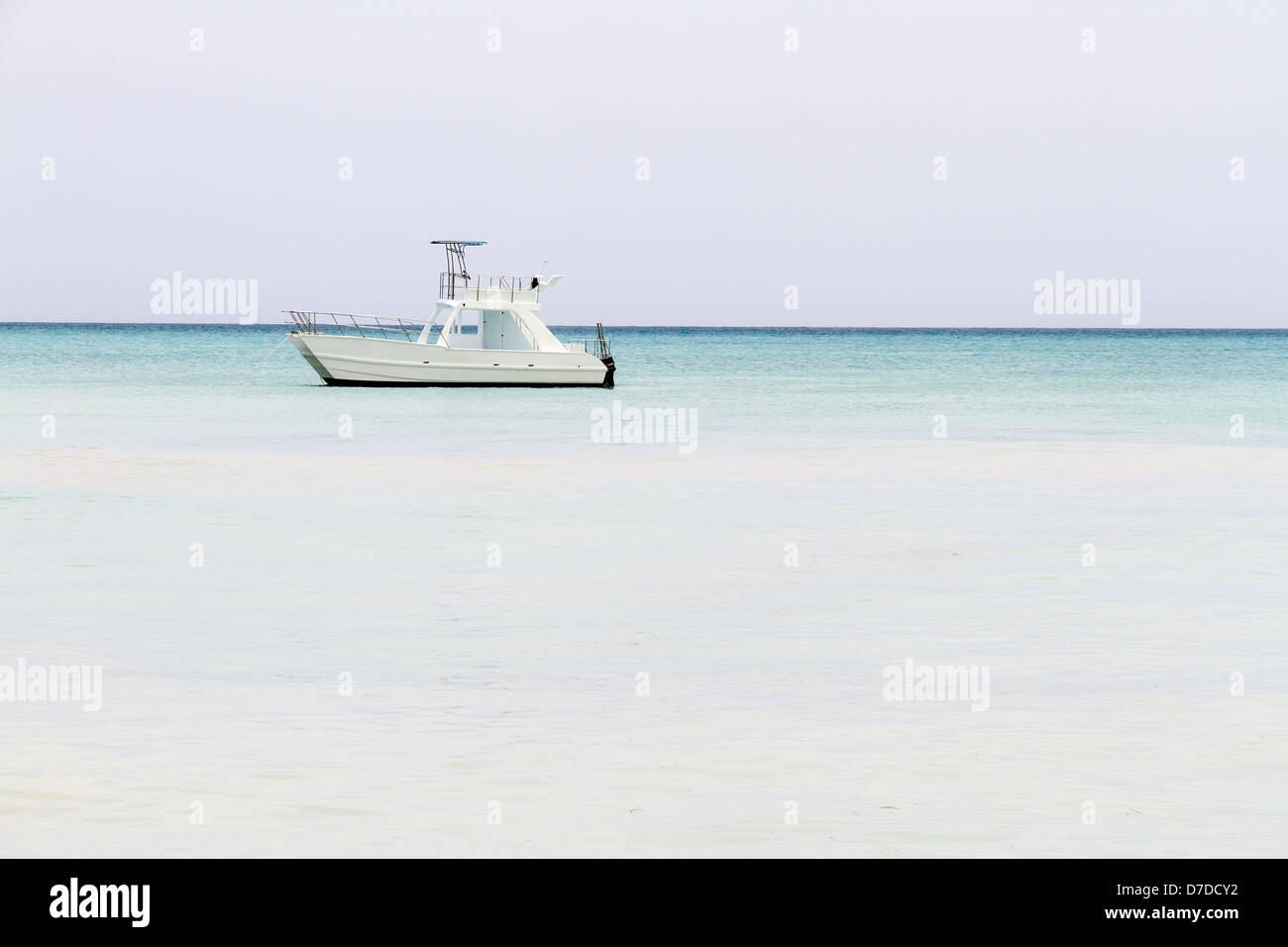 Blue sea with boat in the horizon Stock Photo - Alamy