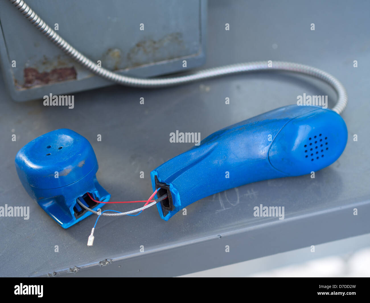 Broken telephone handset in an out of service phone booth Stock Photo ...