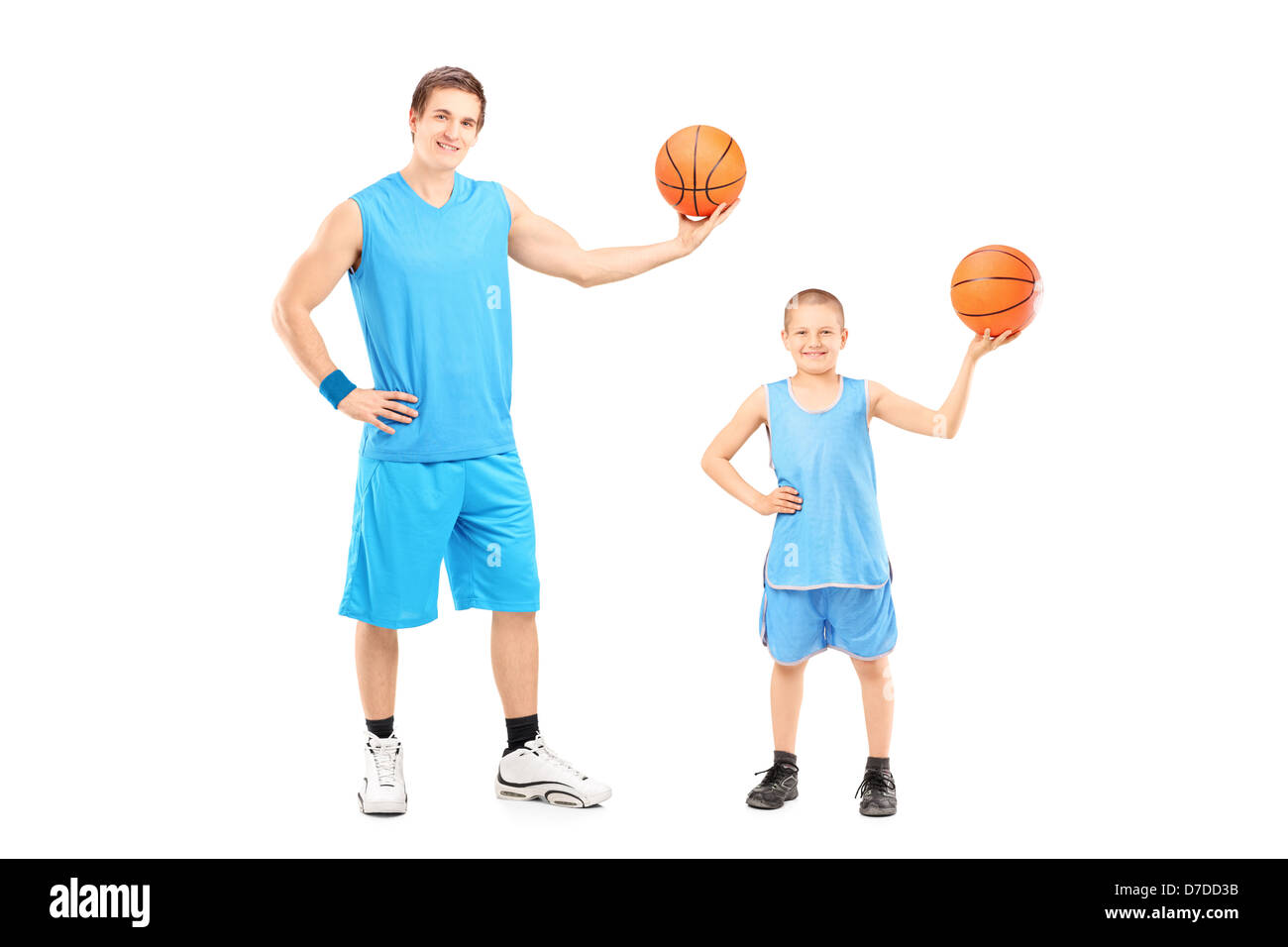 Full length portrait of a basketball players posing isolated on white ...