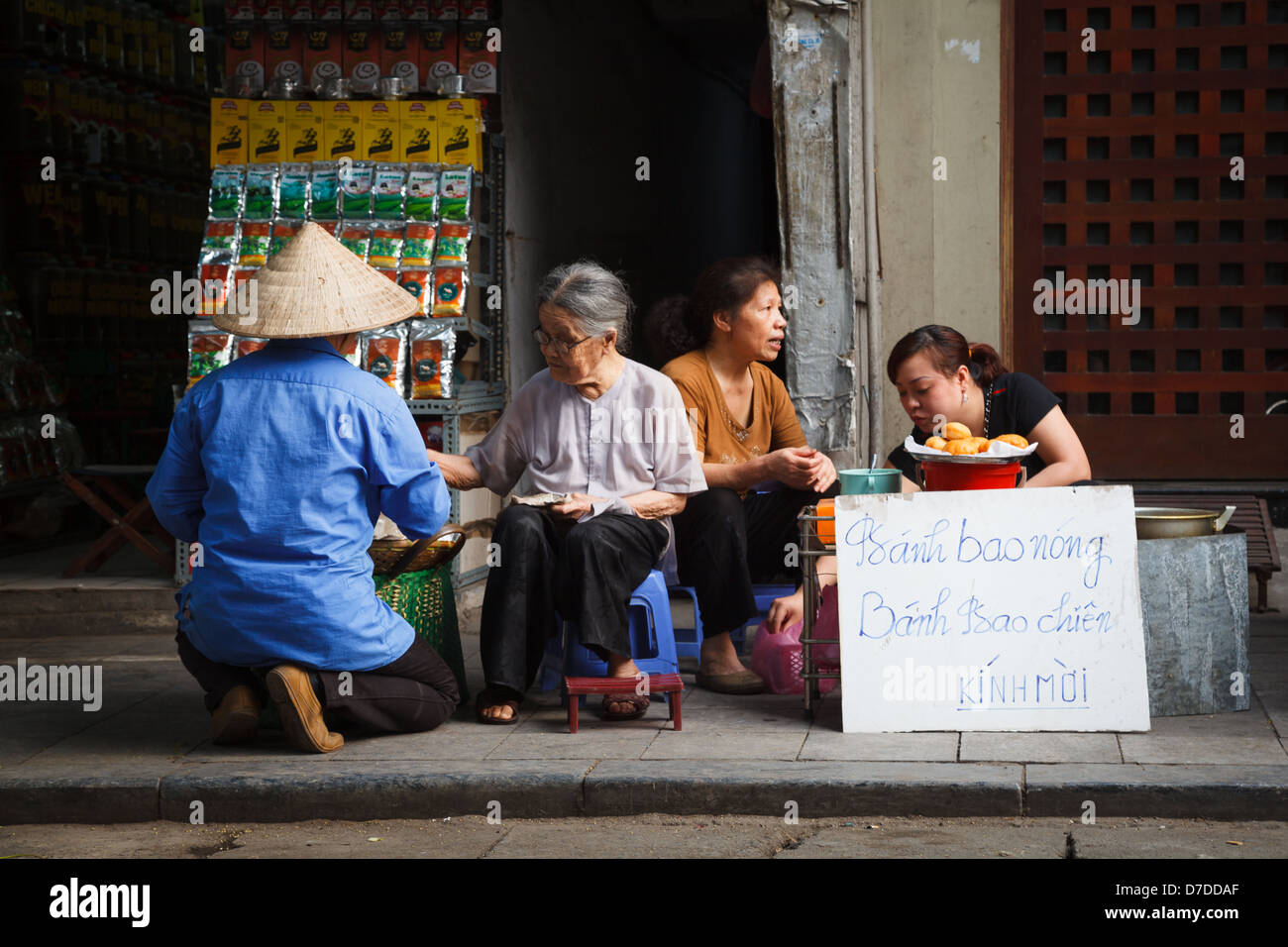 Vietnamese ladies in the Old Quarter of Hanoi selling Banh Bao (steamed ...