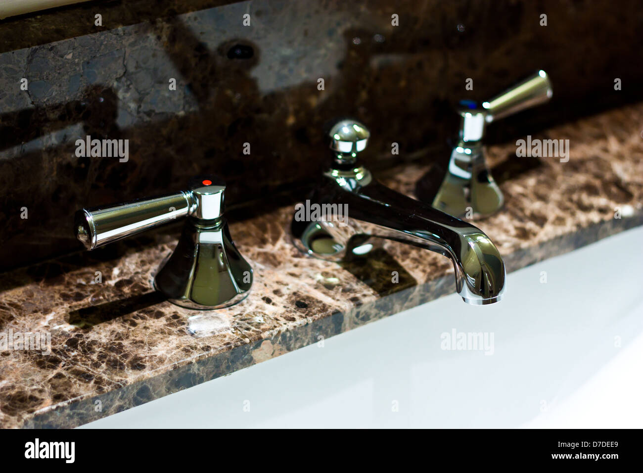 Tap in an Italian luxury hotel, steel on marble Stock Photo - Alamy
