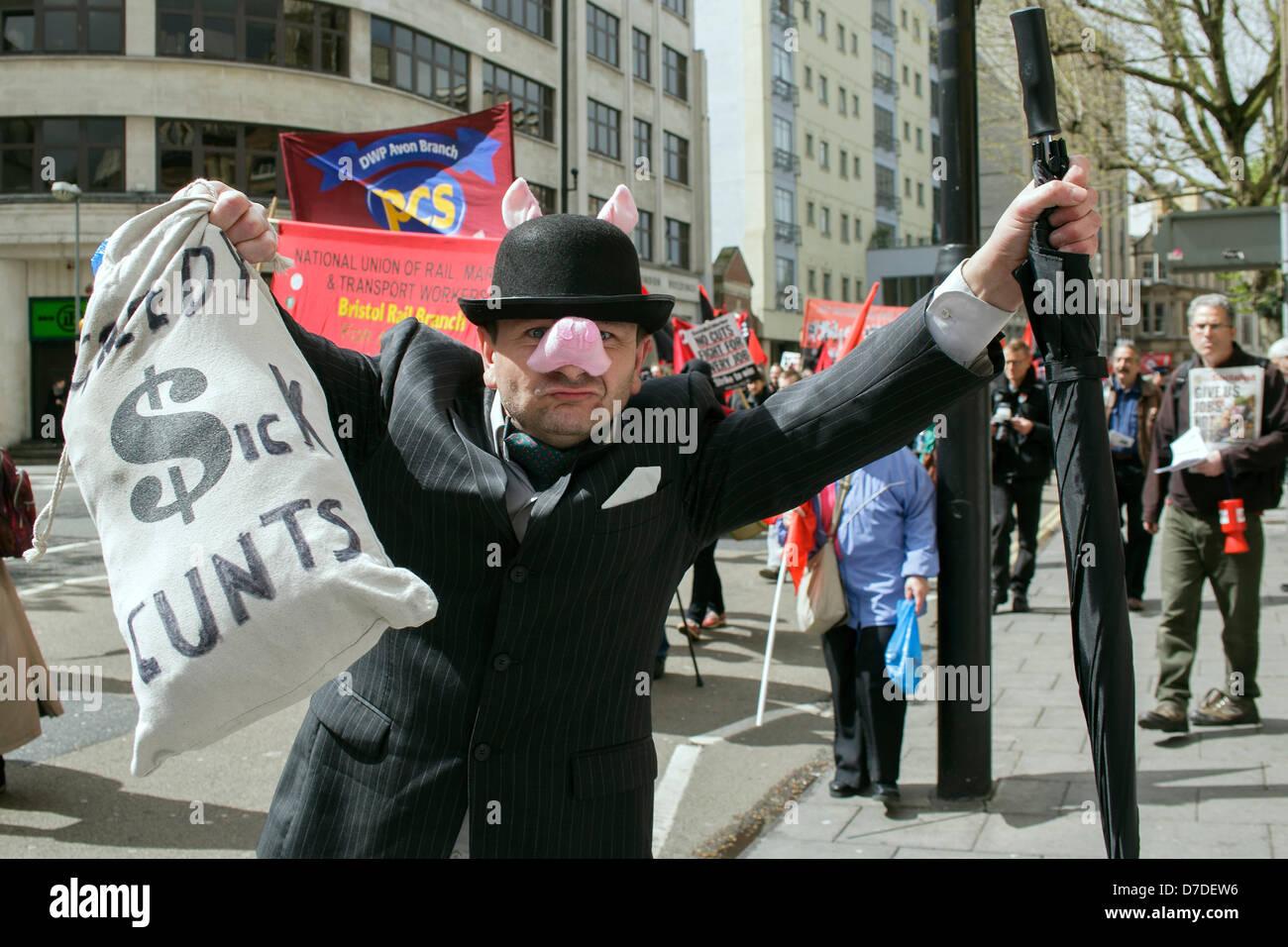 Bristol,UK,May 4th,2013. A Protester dressed as a pig is photographed ...