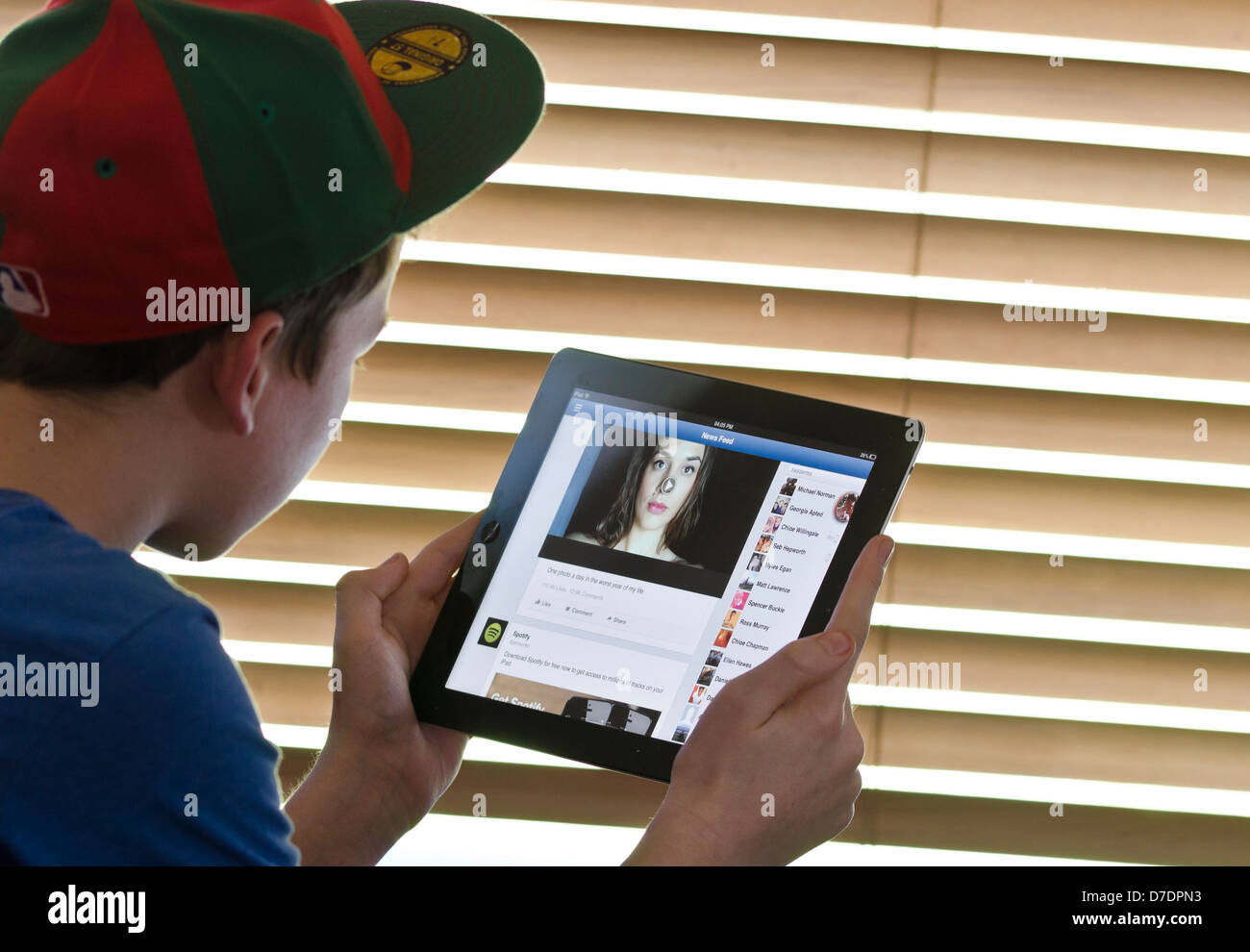 Teenage Boy Viewing Social Media Website Using Ipad Stock Photo - Alamy