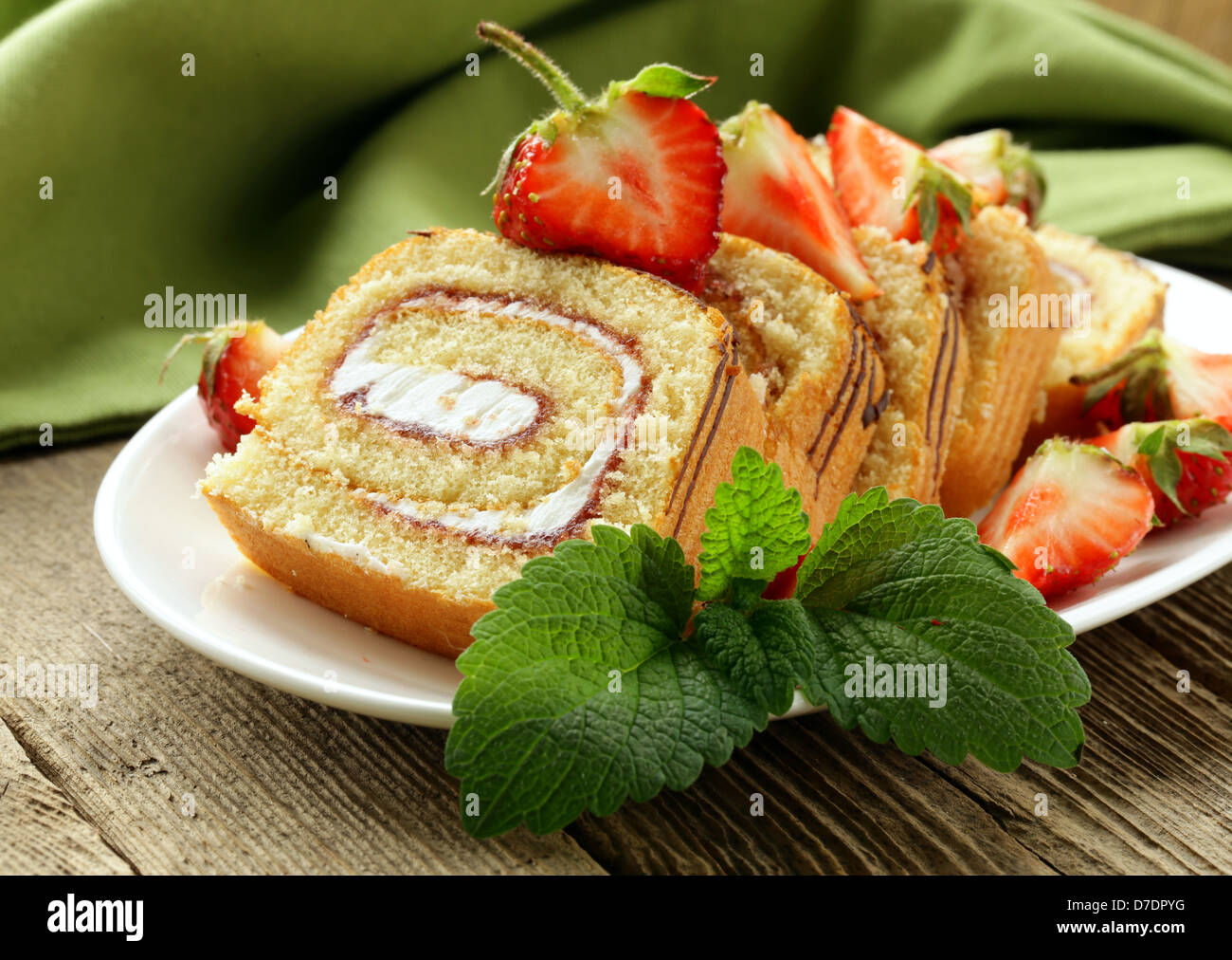 roulade cake with cream and fresh strawberries Stock Photo - Alamy