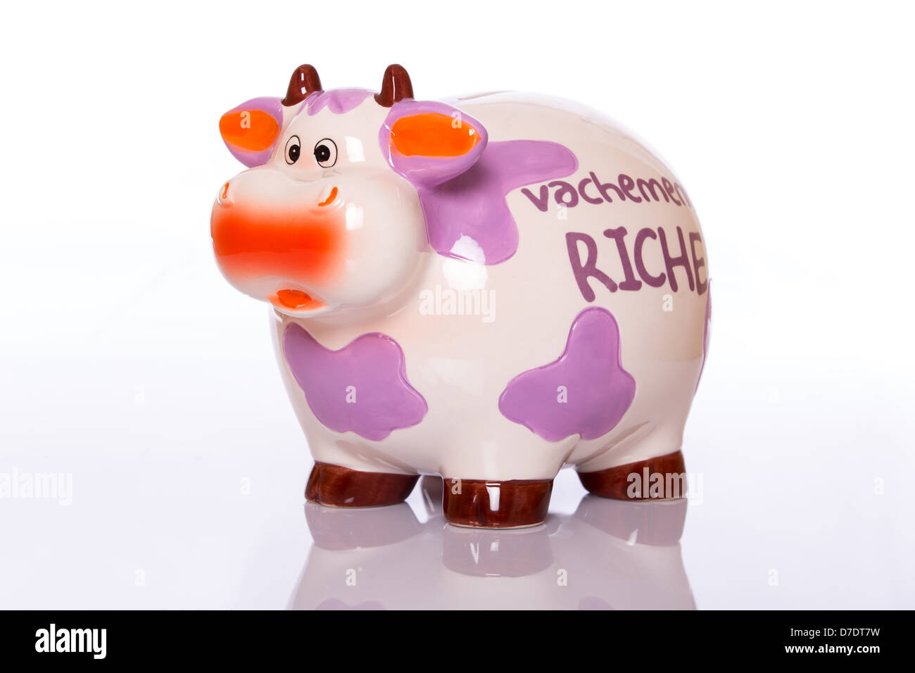 Funny colorful ceramic cow for collecting money Stock Photo - Alamy
