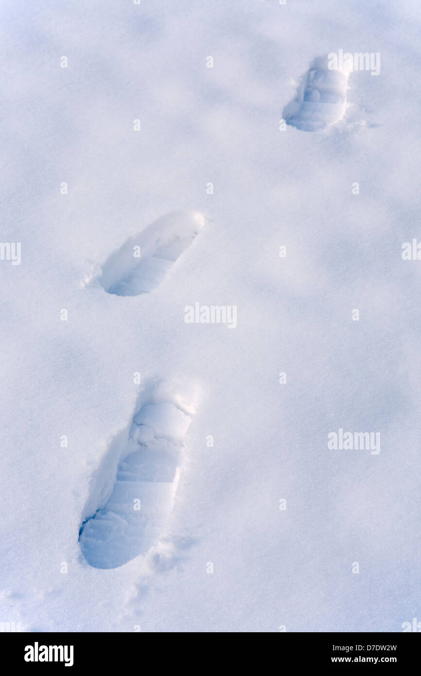 Foot steps on snow Stock Photo - Alamy