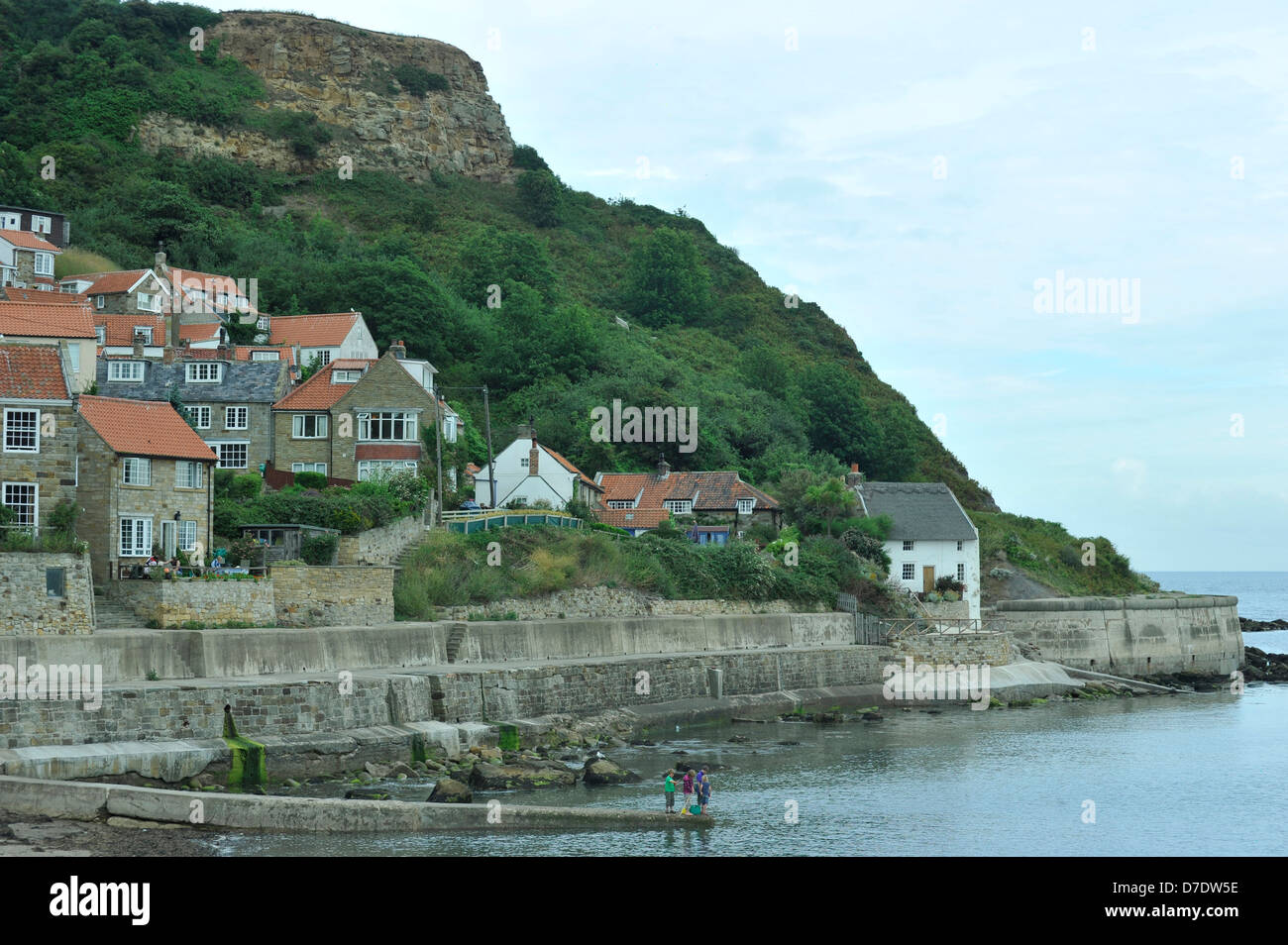 Runwick bay seaside village.people on boat.north sea ,coastline,houses ...
