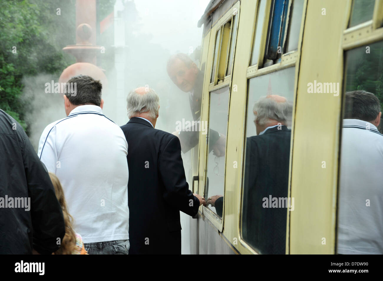 rain waiting to depart.steam train,Goathland railway station,guard ...
