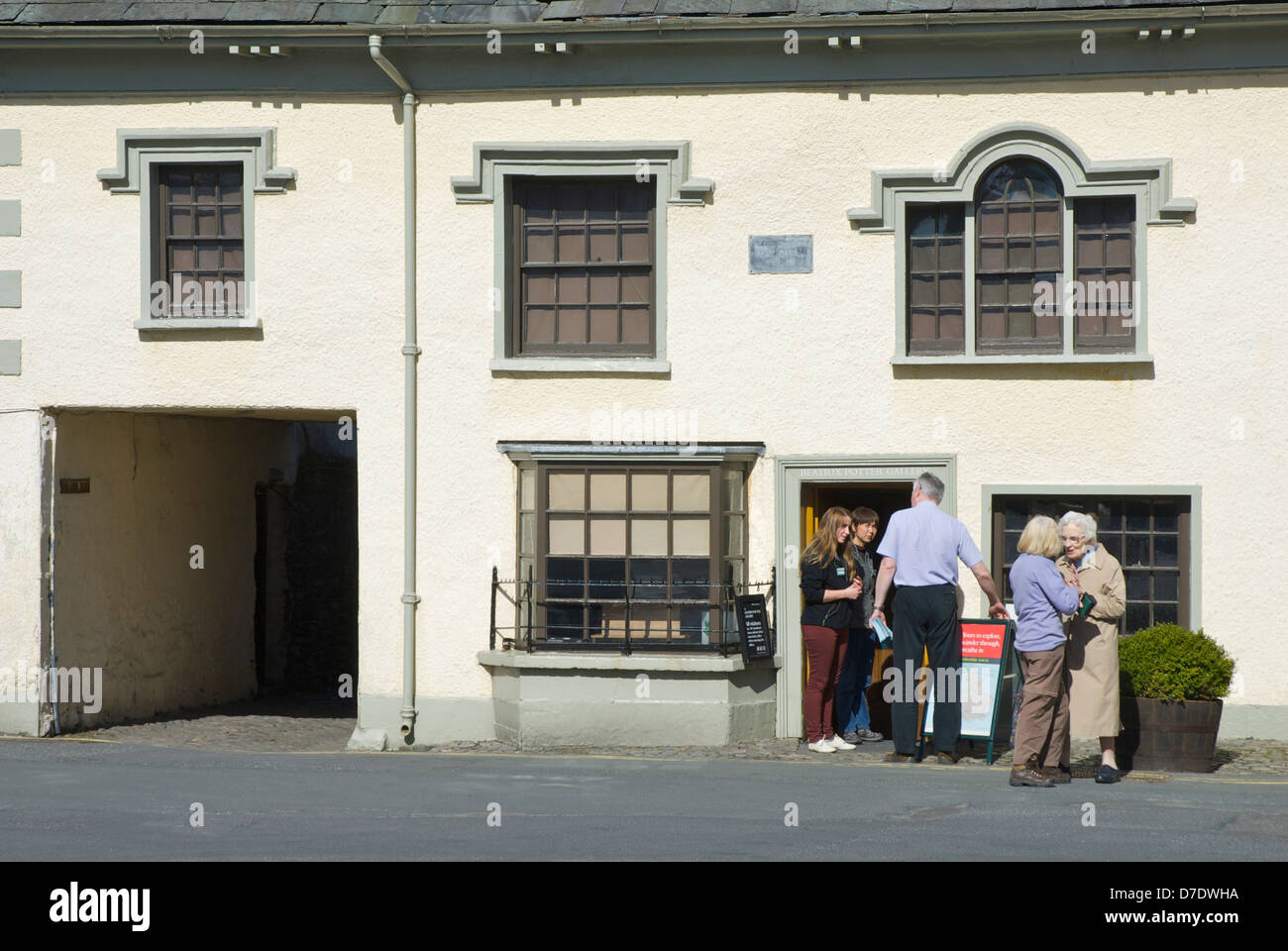 People talking outside the Beatrix Potter Gallery, in Hawkshead, Lake ...