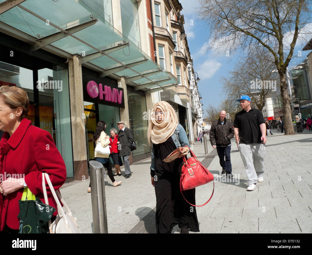 People walking past HMV shop along Queen Street in Cardiff City Centre ...