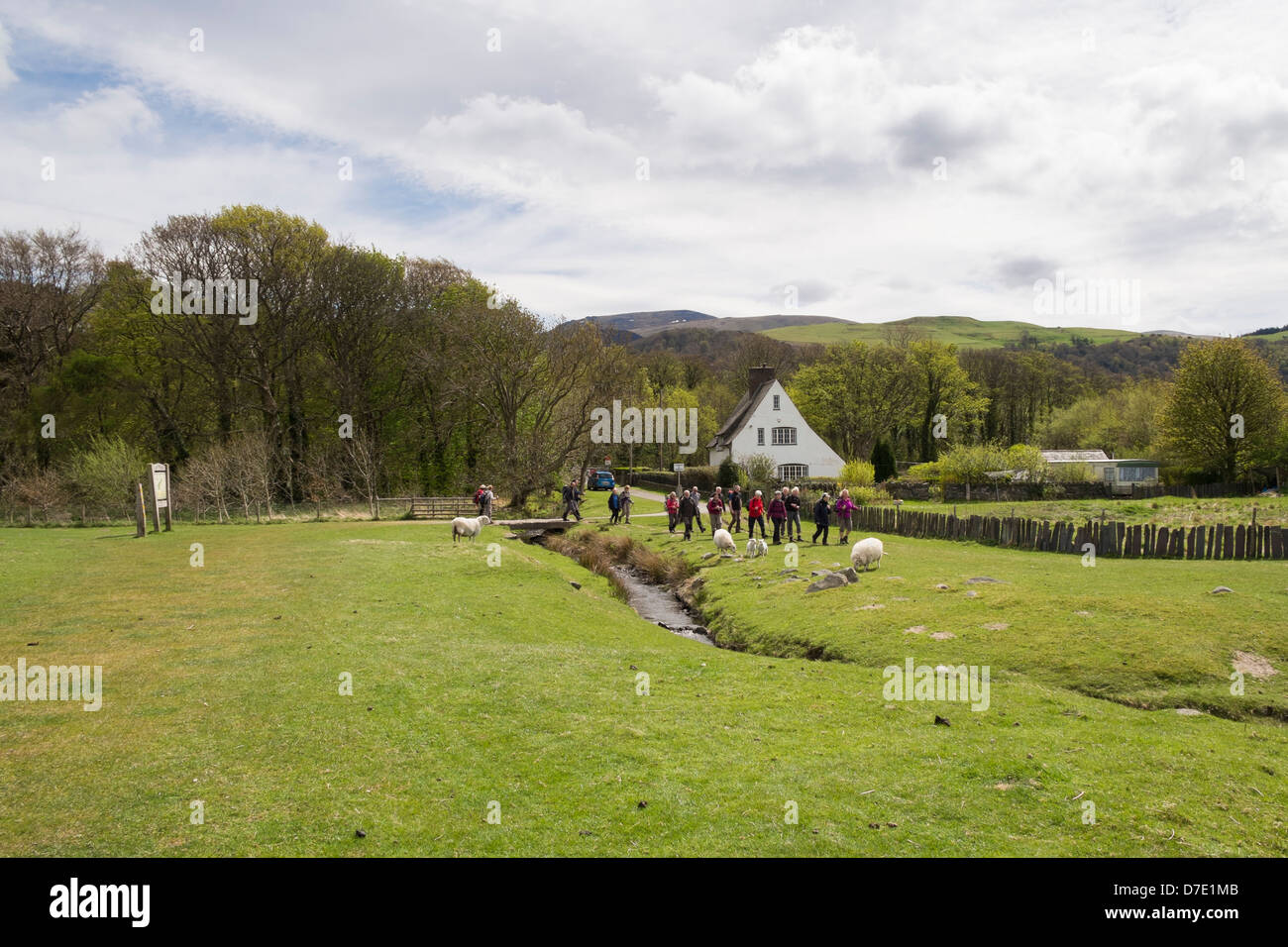 Glan y Mor Elias coastal nature reserve with walkers on Wales Coastal ...