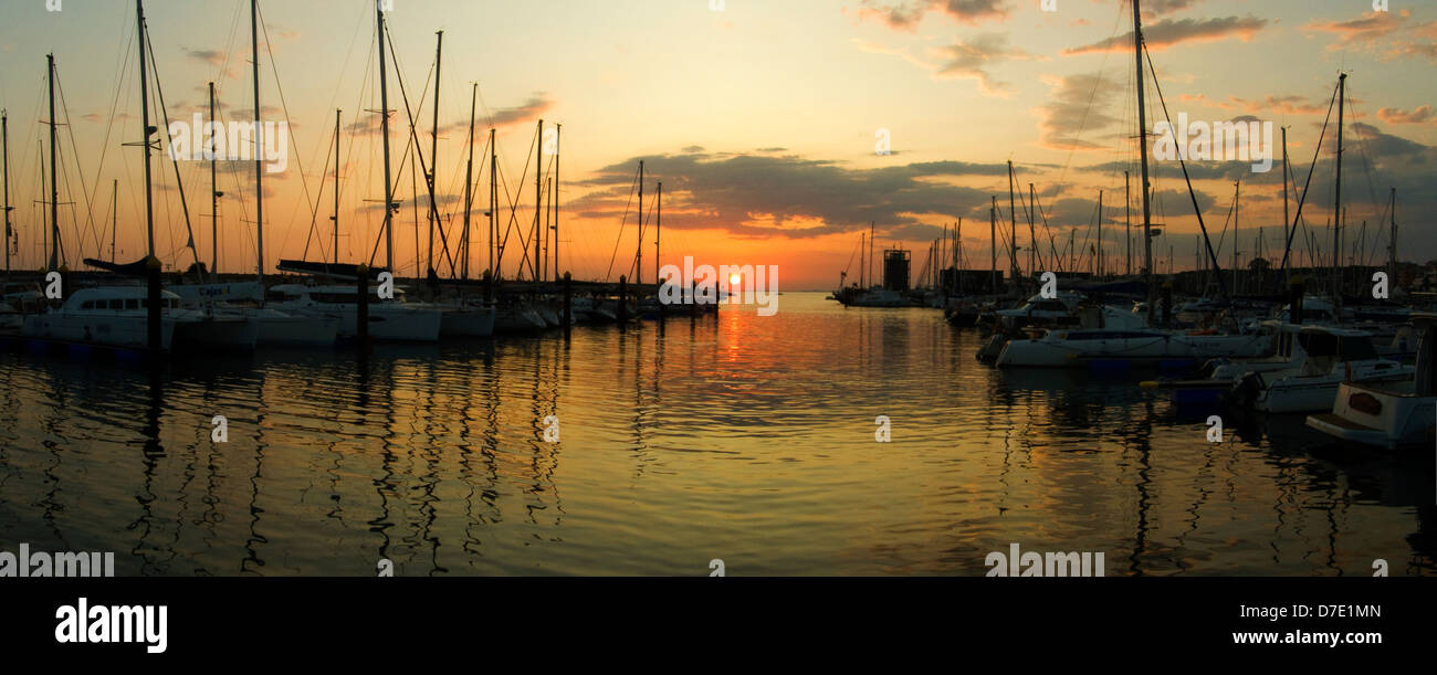 Sunset at harbor Stock Photo - Alamy
