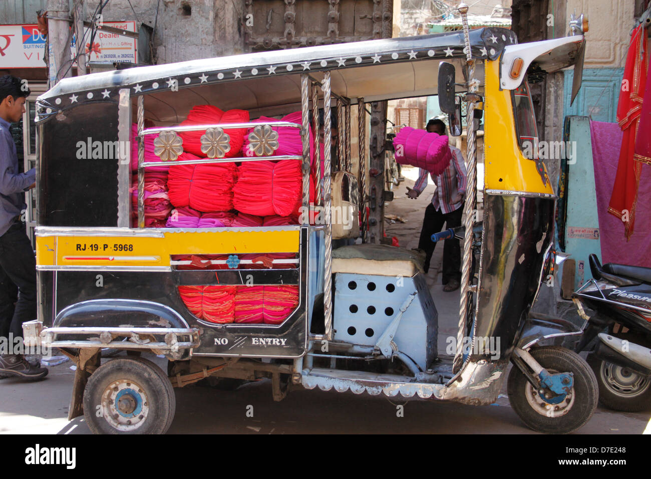 Dyed material being delivered by Rickshaw to a workshop Stock Photo - Alamy