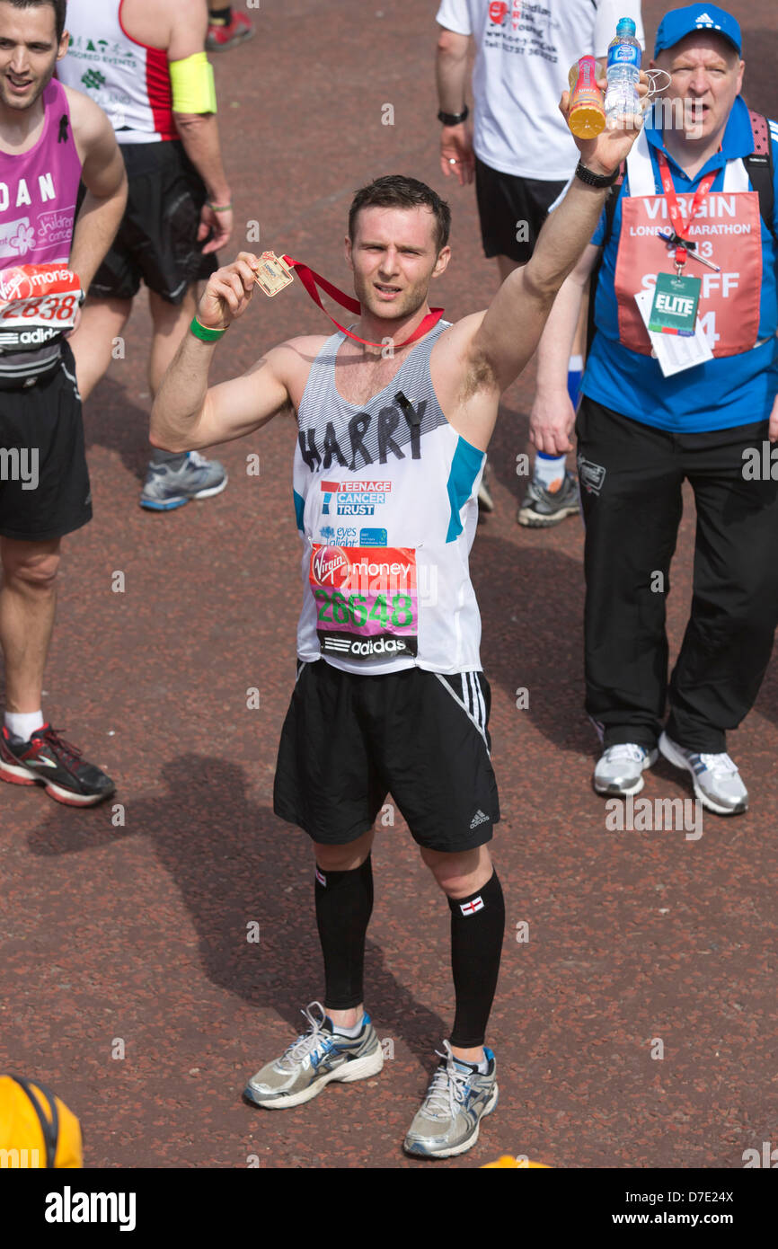 Virgin London Marathon 2013, Harry Judd of McFly celebrates the finish ...