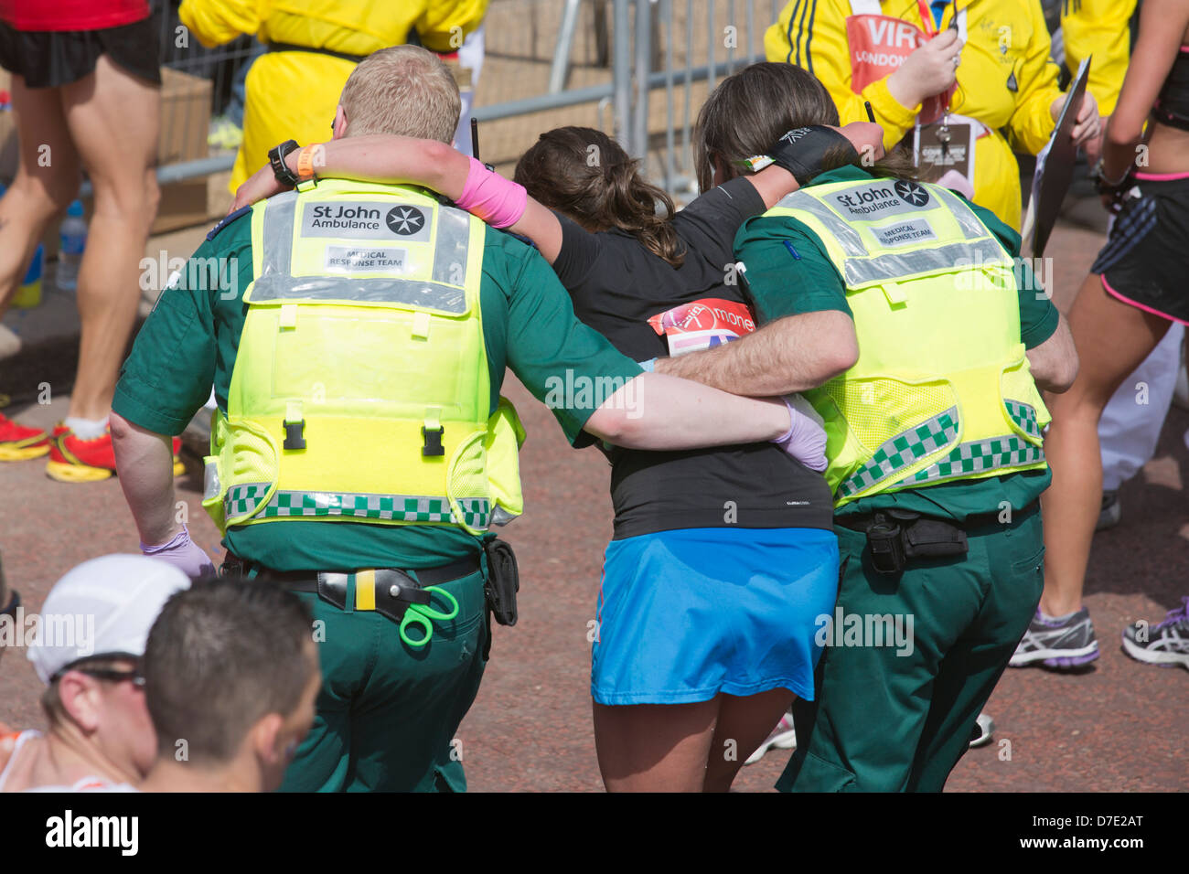 Virgin London Marathon 2013, an exhausted runner is looked after by St ...