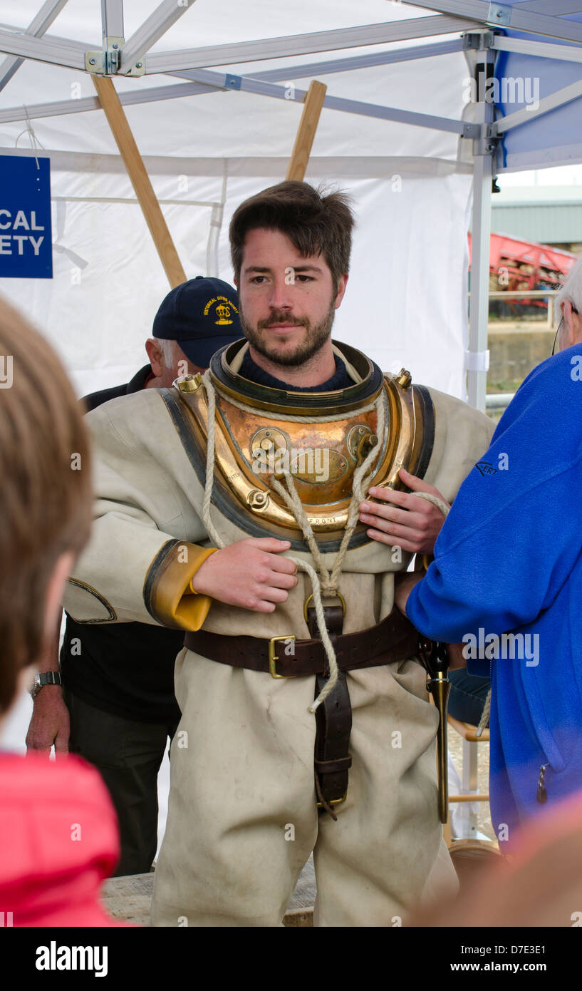 the historical diving society suiting up a diver Stock Photo - Alamy