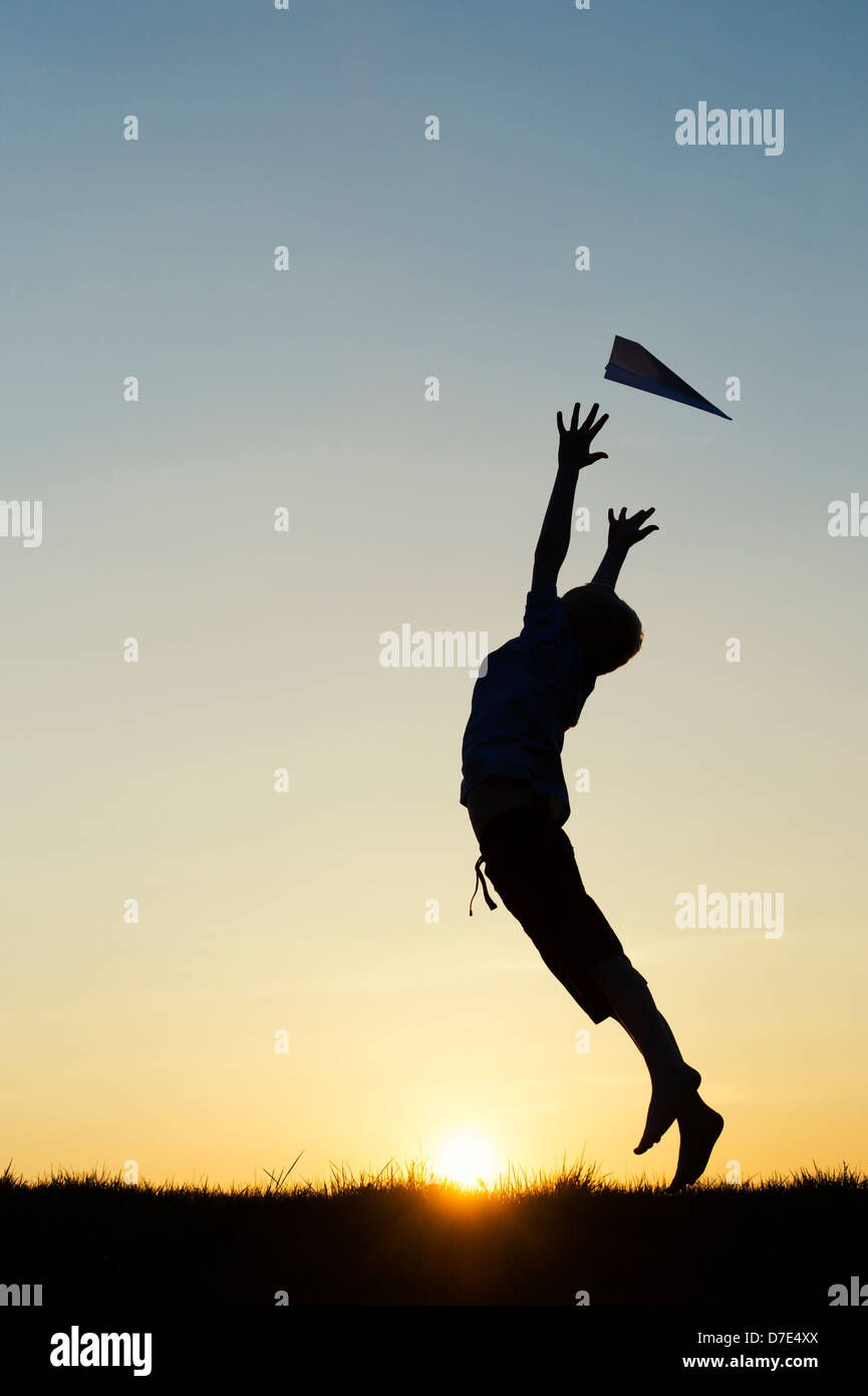 Child catching paper plane hi-res stock photography and images - Alamy