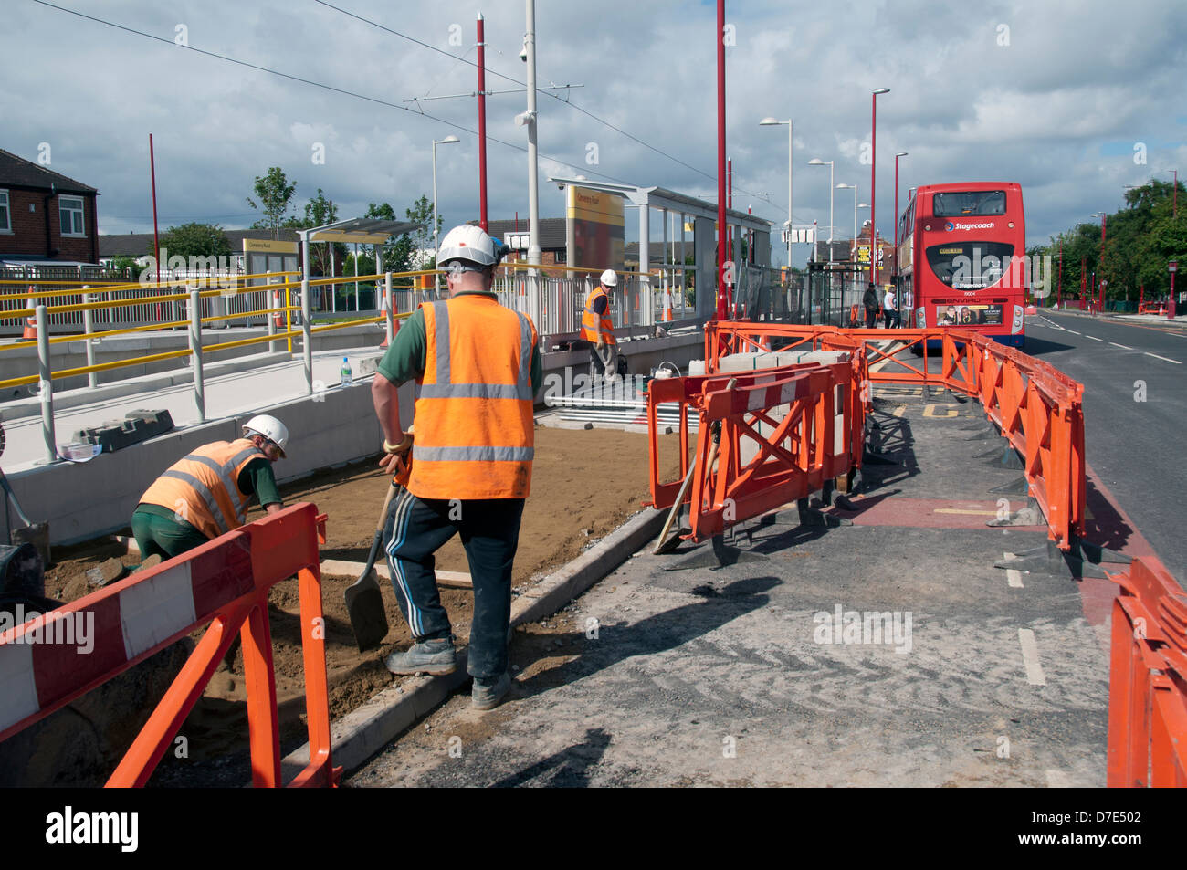 Laying new paving stones at the Cemetery Road Metrolink tram stop ...