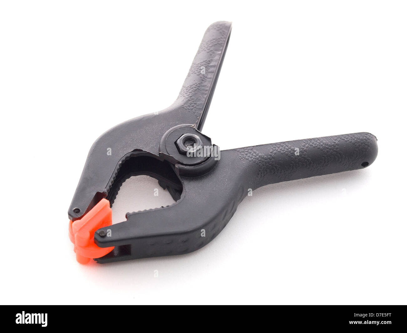 Plastic clamp isolated on white. A multipurpose tool Stock Photo - Alamy