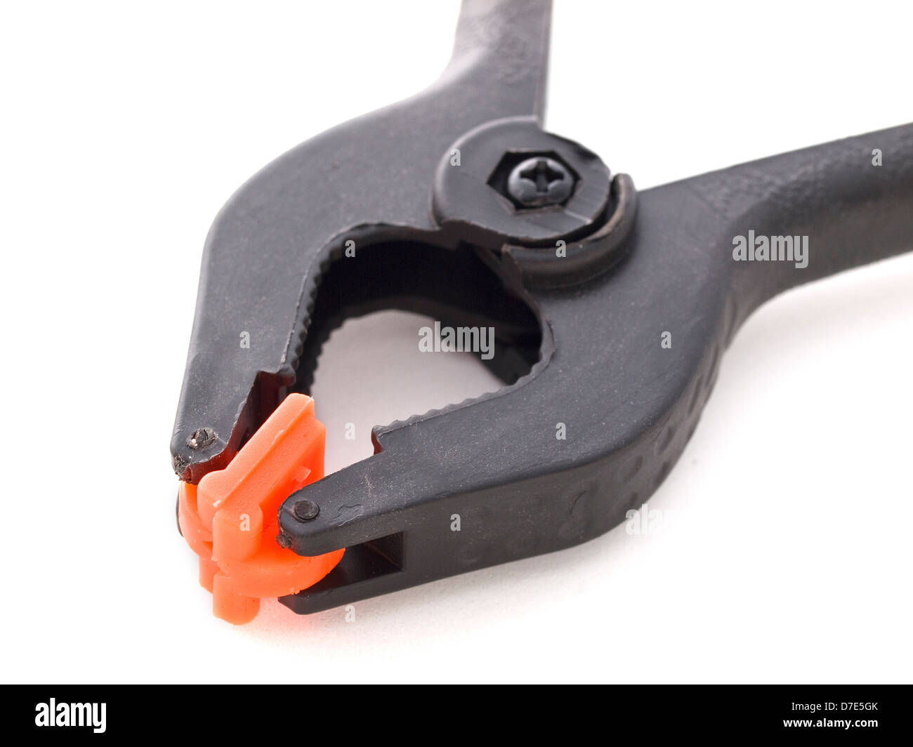 Plastic clamp isolated on white. A multipurpose tool Stock Photo - Alamy