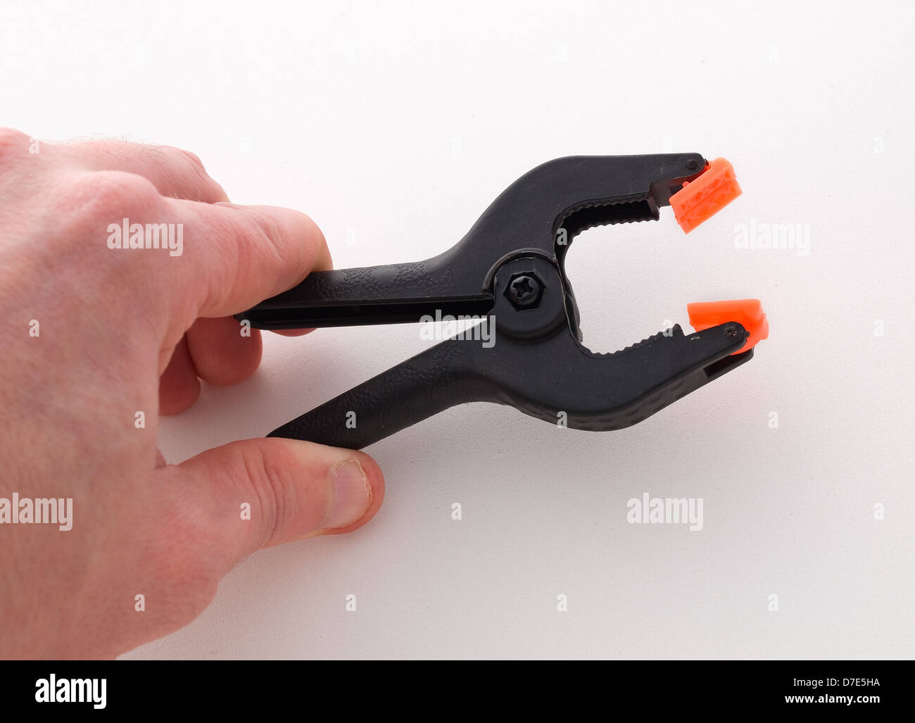 Hand tightening a clamp and isolated on white background Stock Photo ...