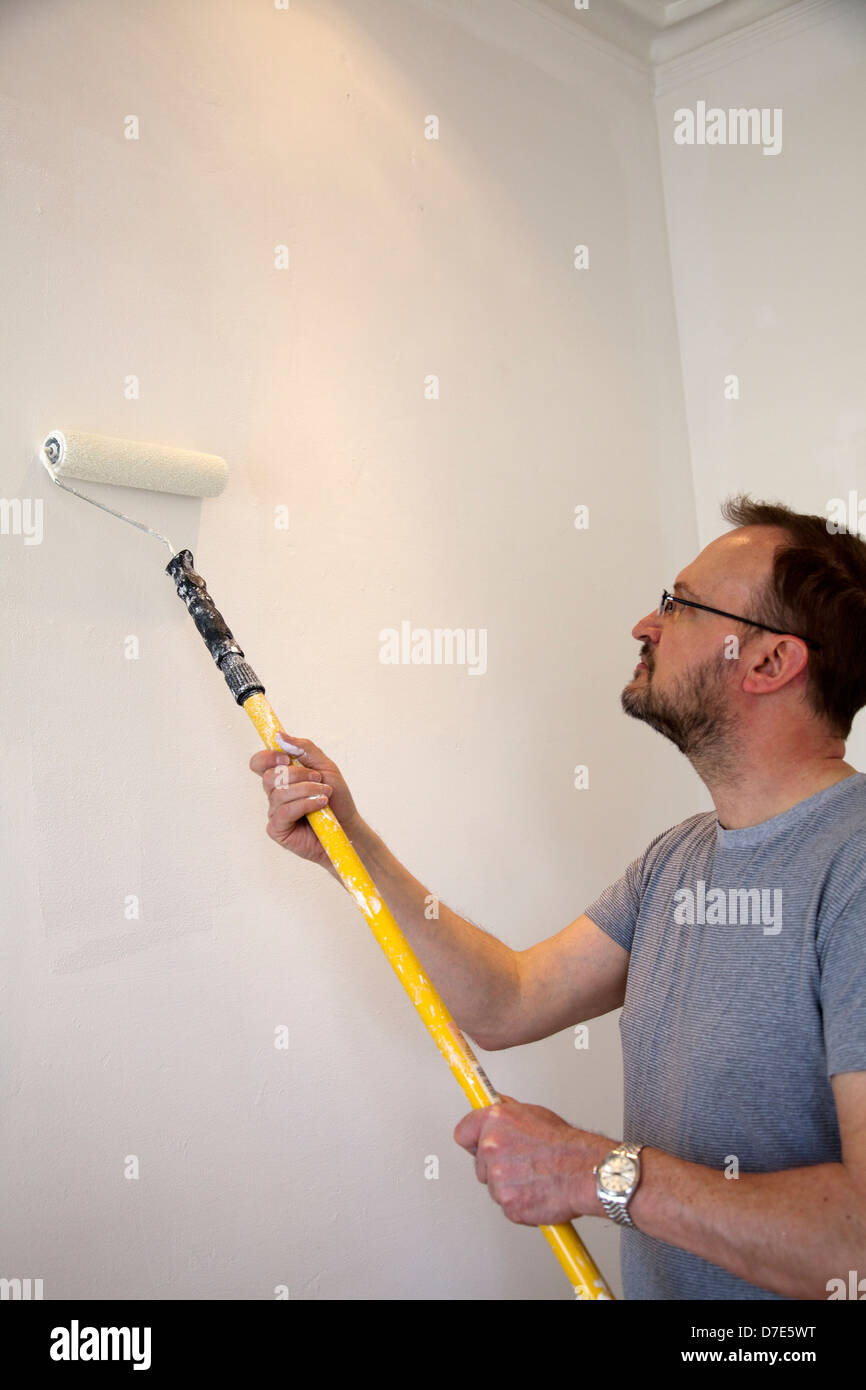 Man Painting Wall Stock Photo - Alamy