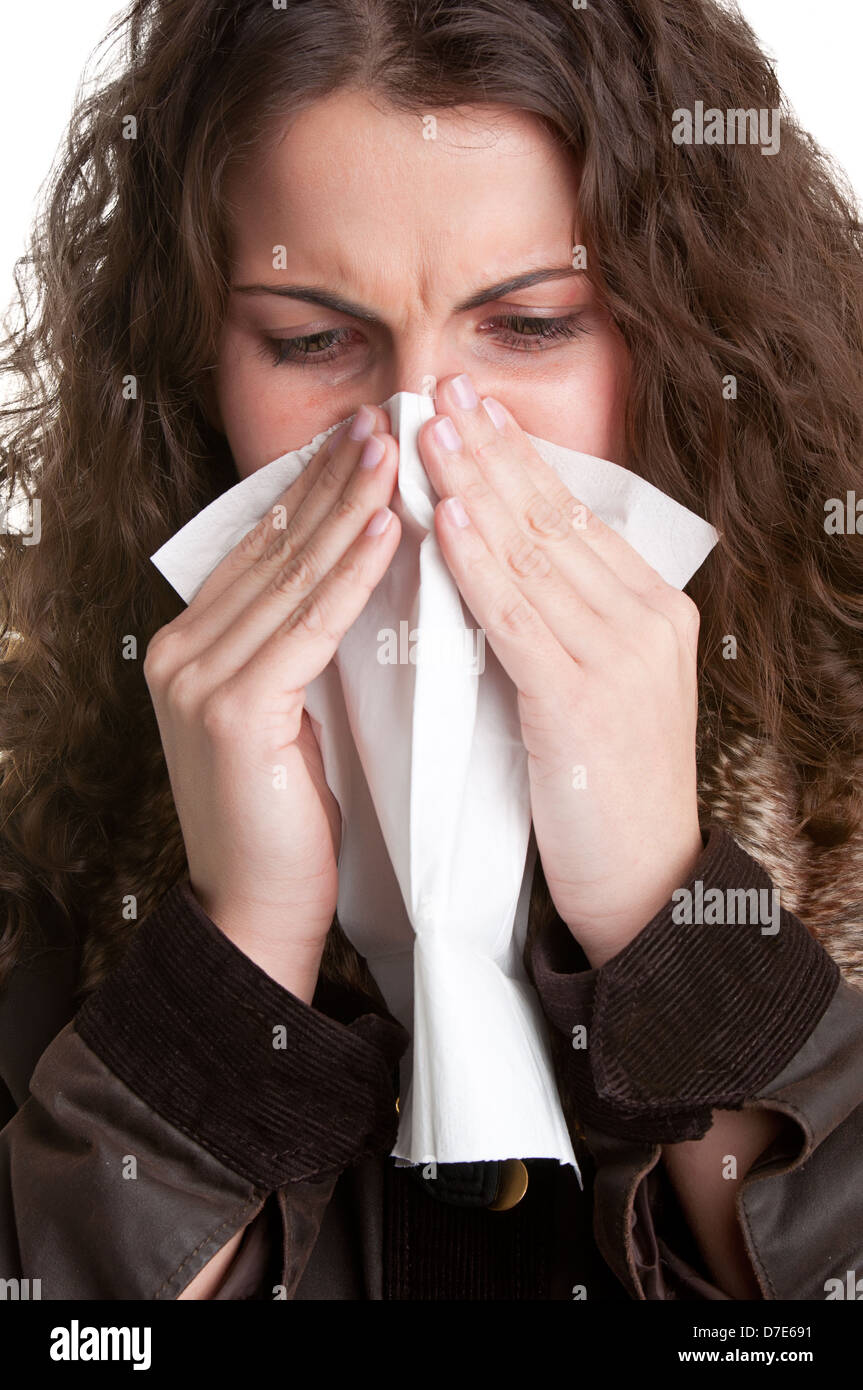 Pale sick woman with a flu, sneezing, in a white background Stock Photo ...