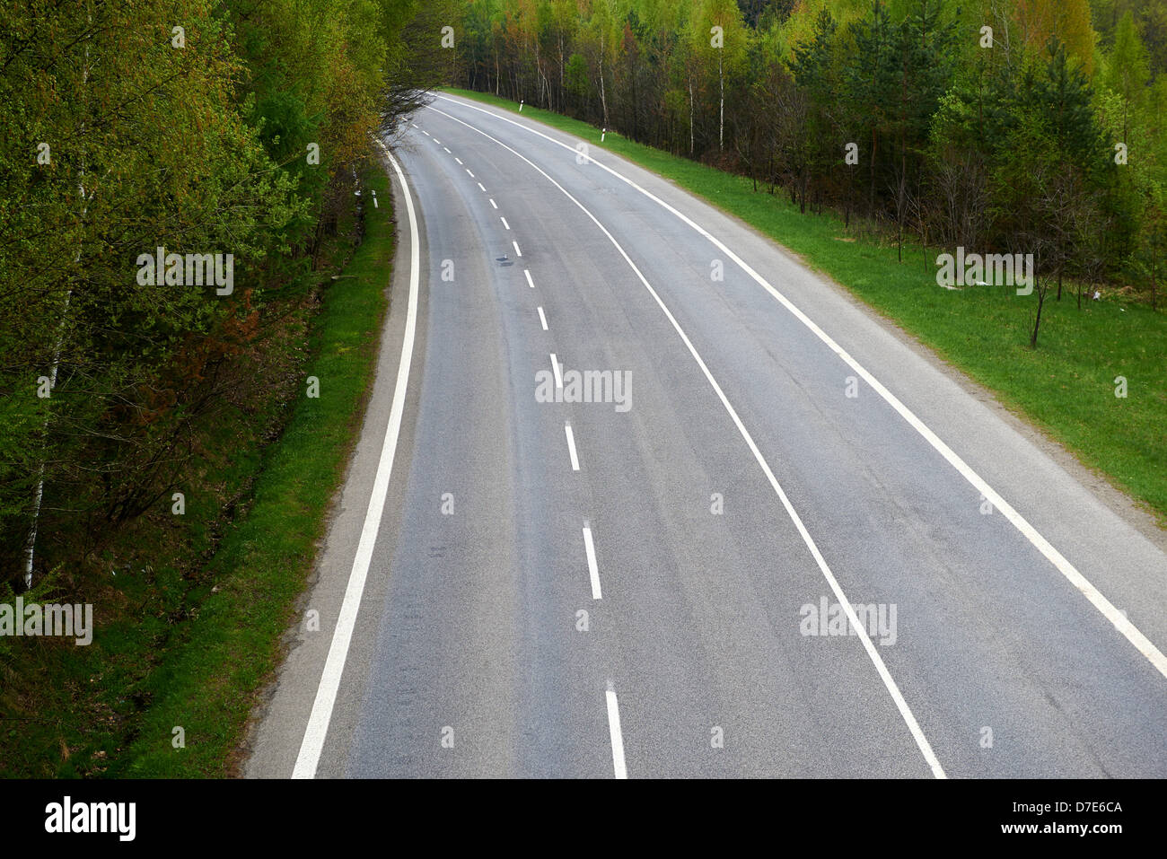 View of curved road without cars Stock Photo - Alamy