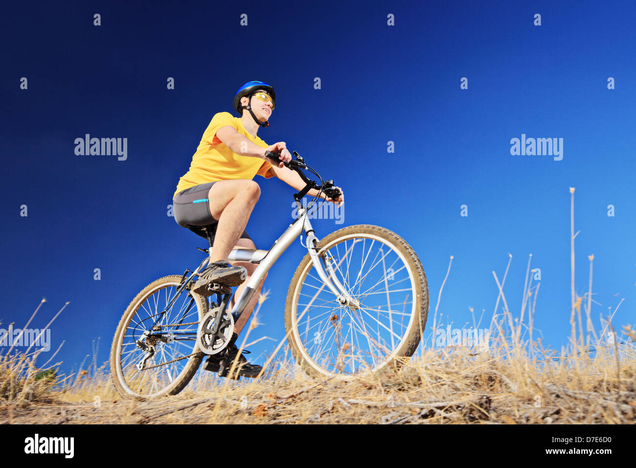 A young male riding a mountain bike outdoors Stock Photo - Alamy