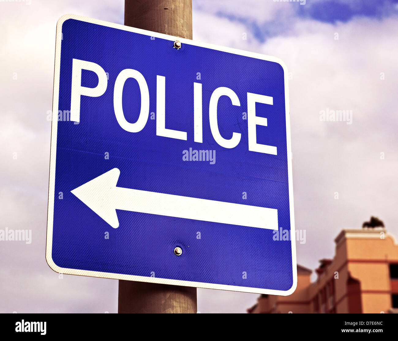 a sign points to the local police station Stock Photo - Alamy