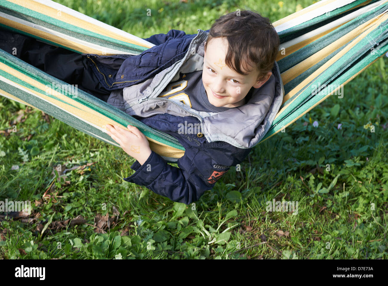 Young child boy resting on a hammock summer time Stock Photo - Alamy