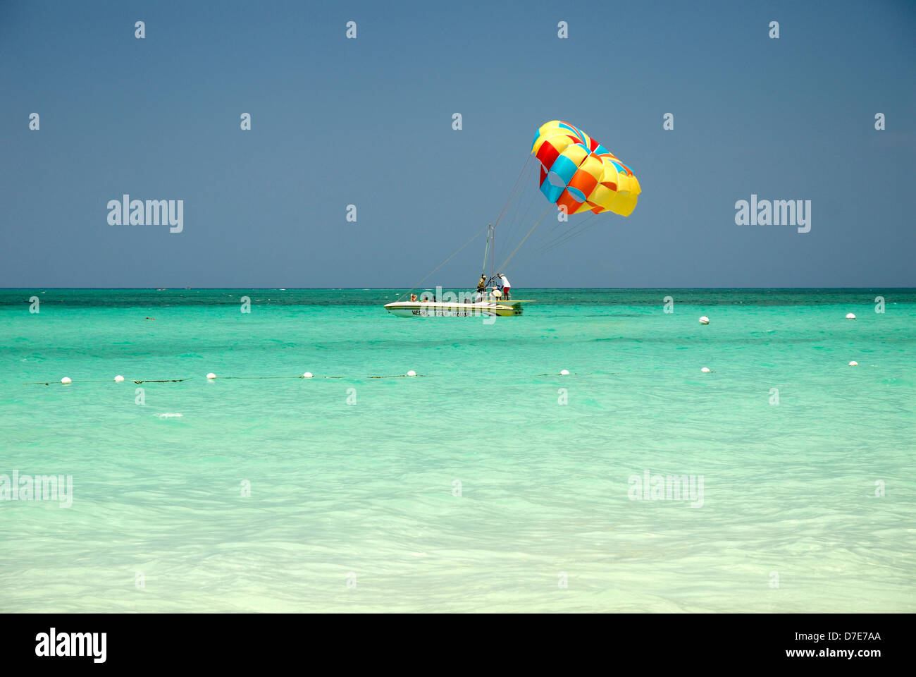 Parasailer off of 7-Mile Beach Stock Photo - Alamy