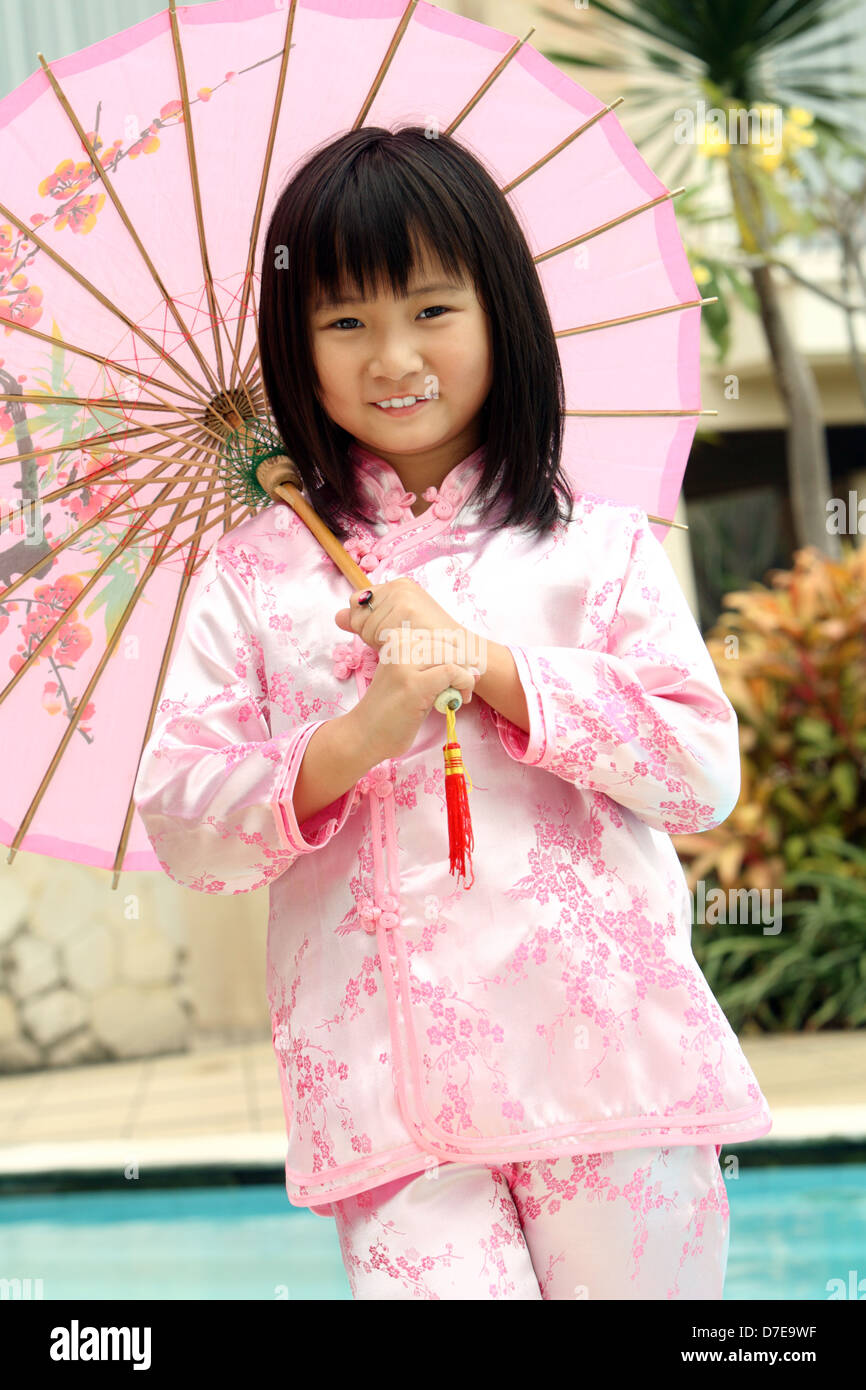 Chinese child holding umbrella Stock Photo - Alamy