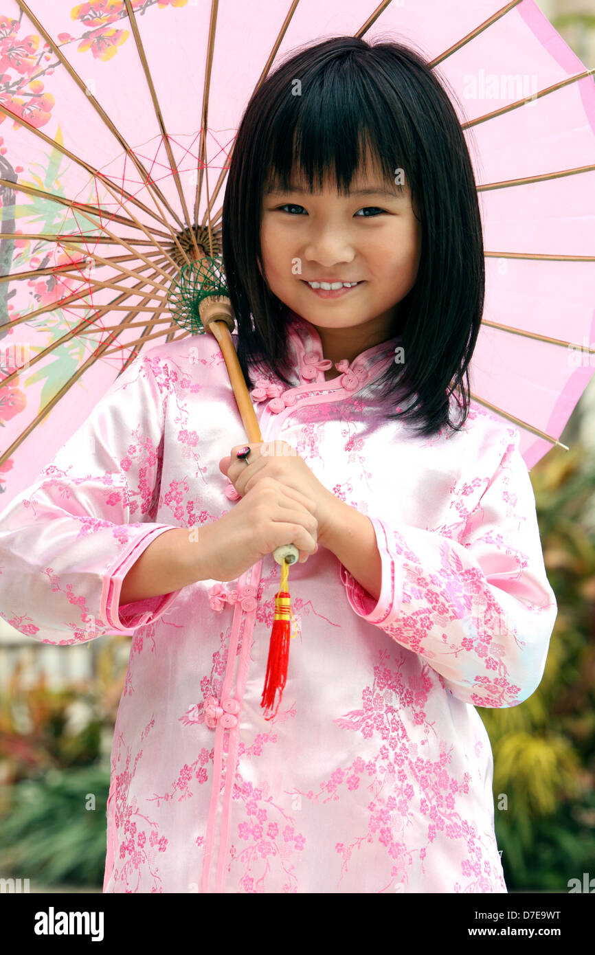 Child holding an umbrella Stock Photo - Alamy