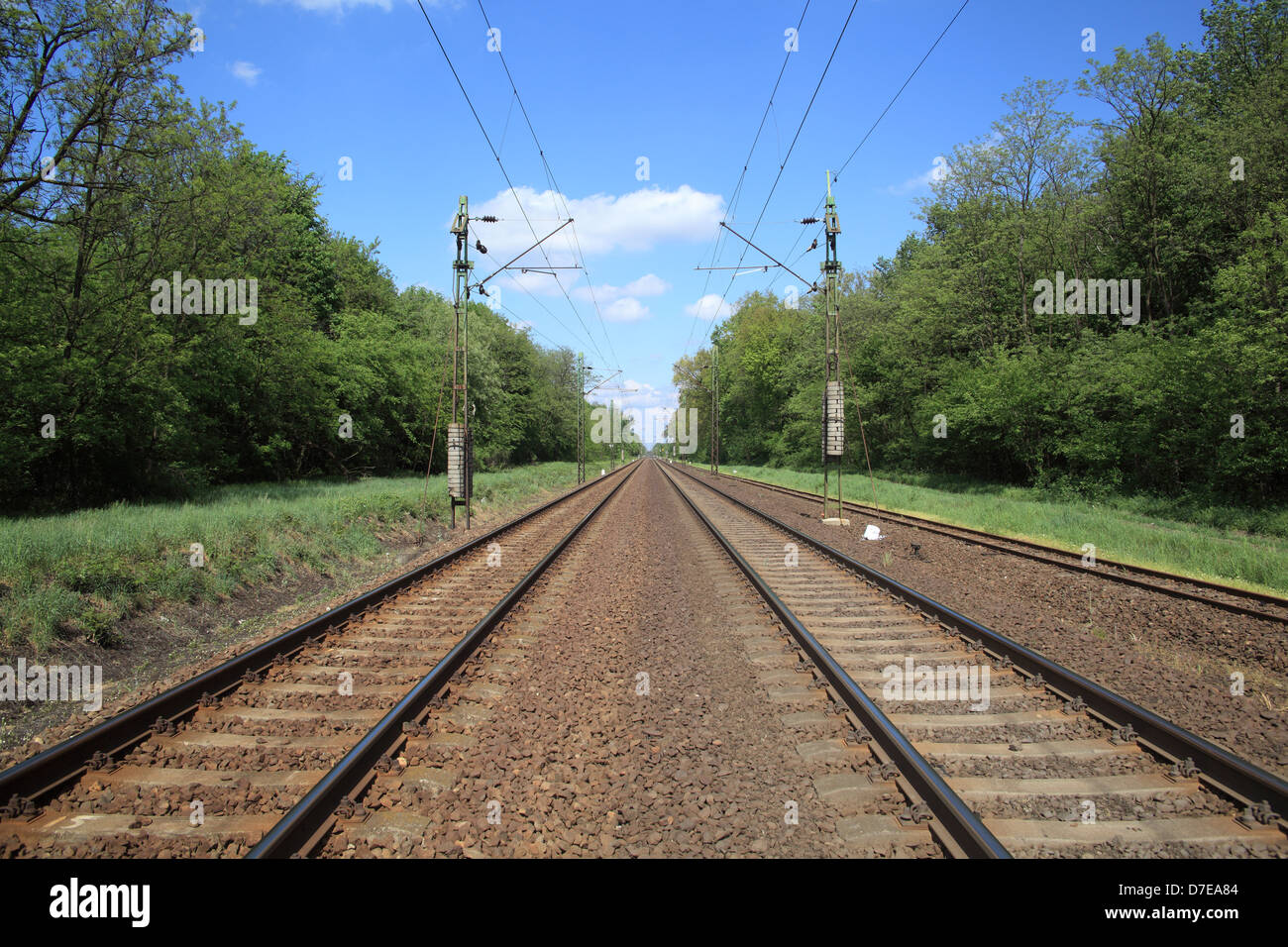 Train tracks leading off into the distance Stock Photo - Alamy