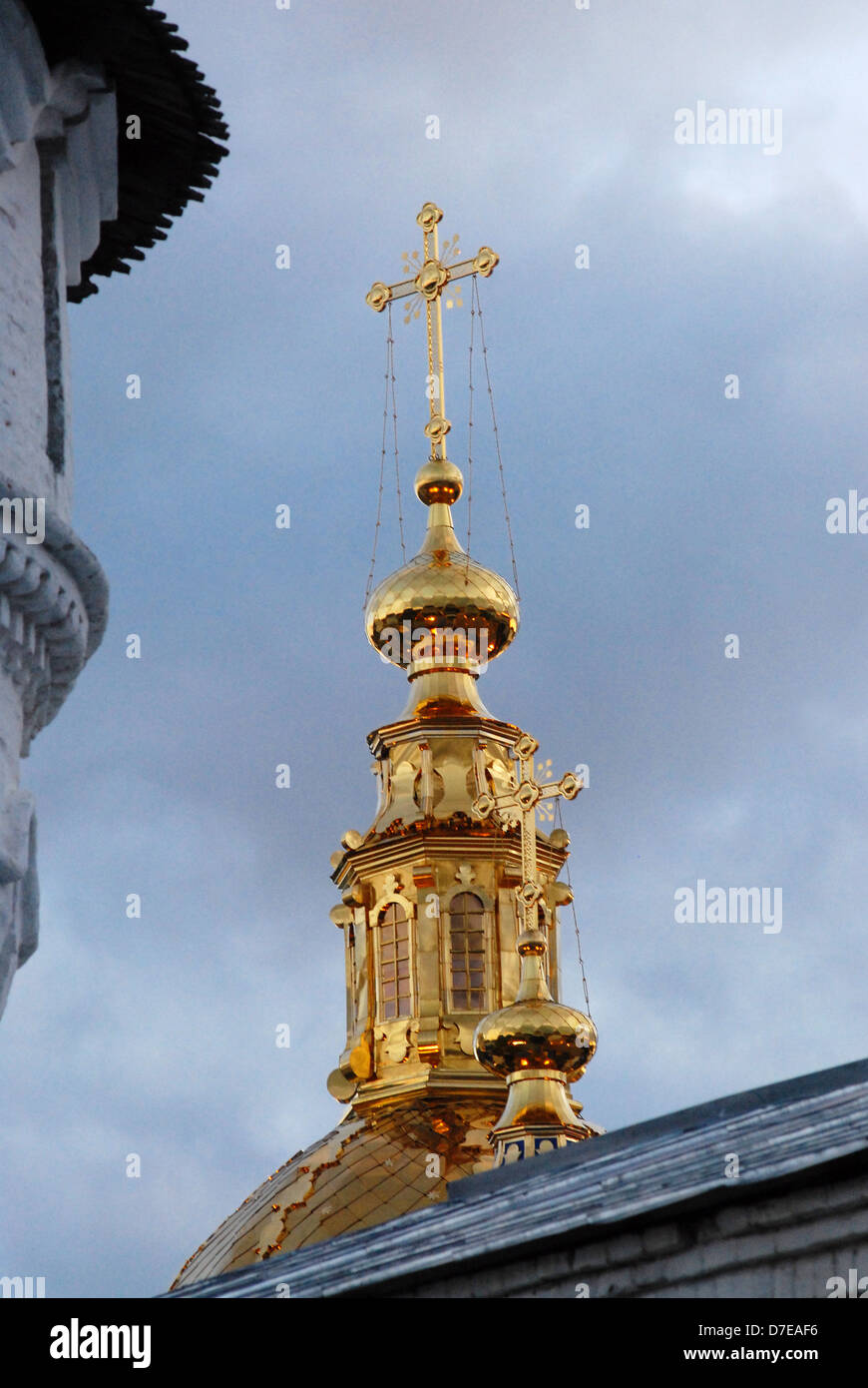 Golden domes and crosses of an orthodox temple in the cloudy sky ...
