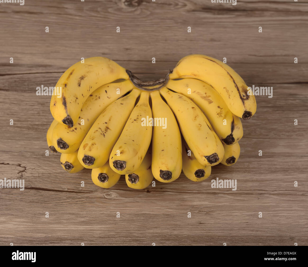 Yellow bananas on wooden background Stock Photo - Alamy
