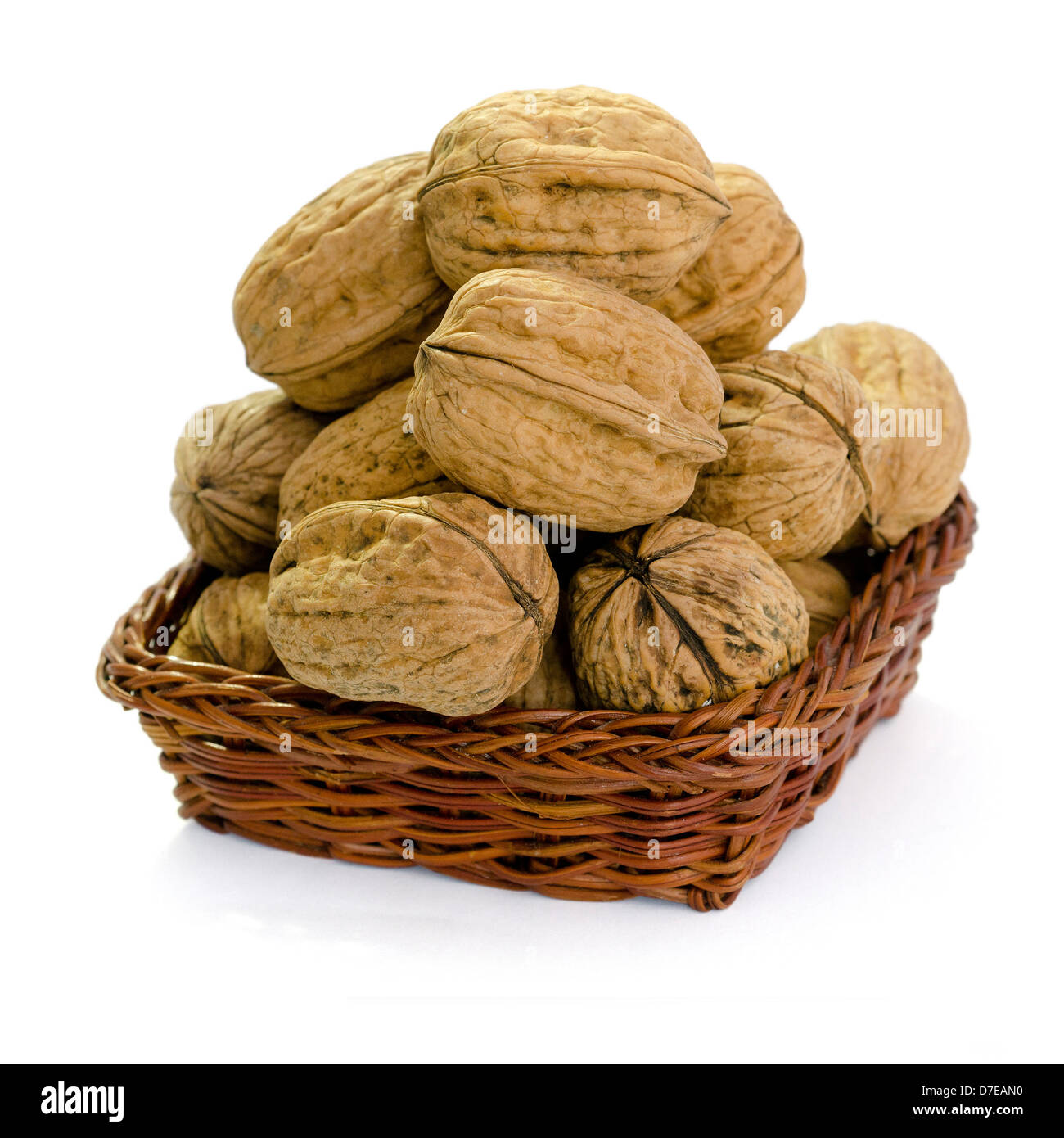 Walnuts in a Basket Isolated on White Background Stock Photo - Alamy