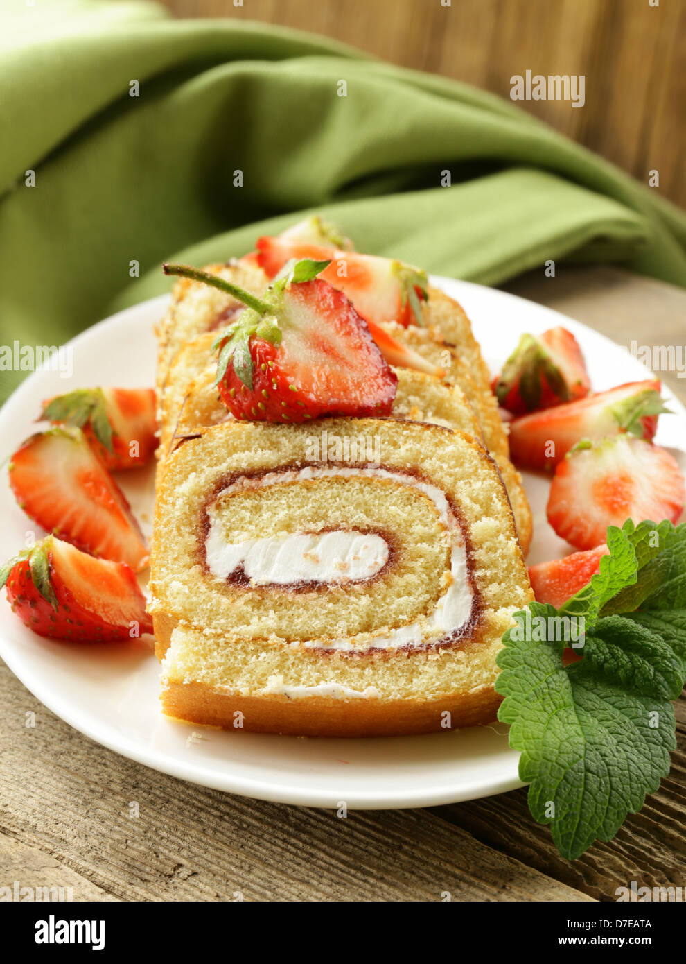 roulade cake with cream and fresh strawberries Stock Photo - Alamy
