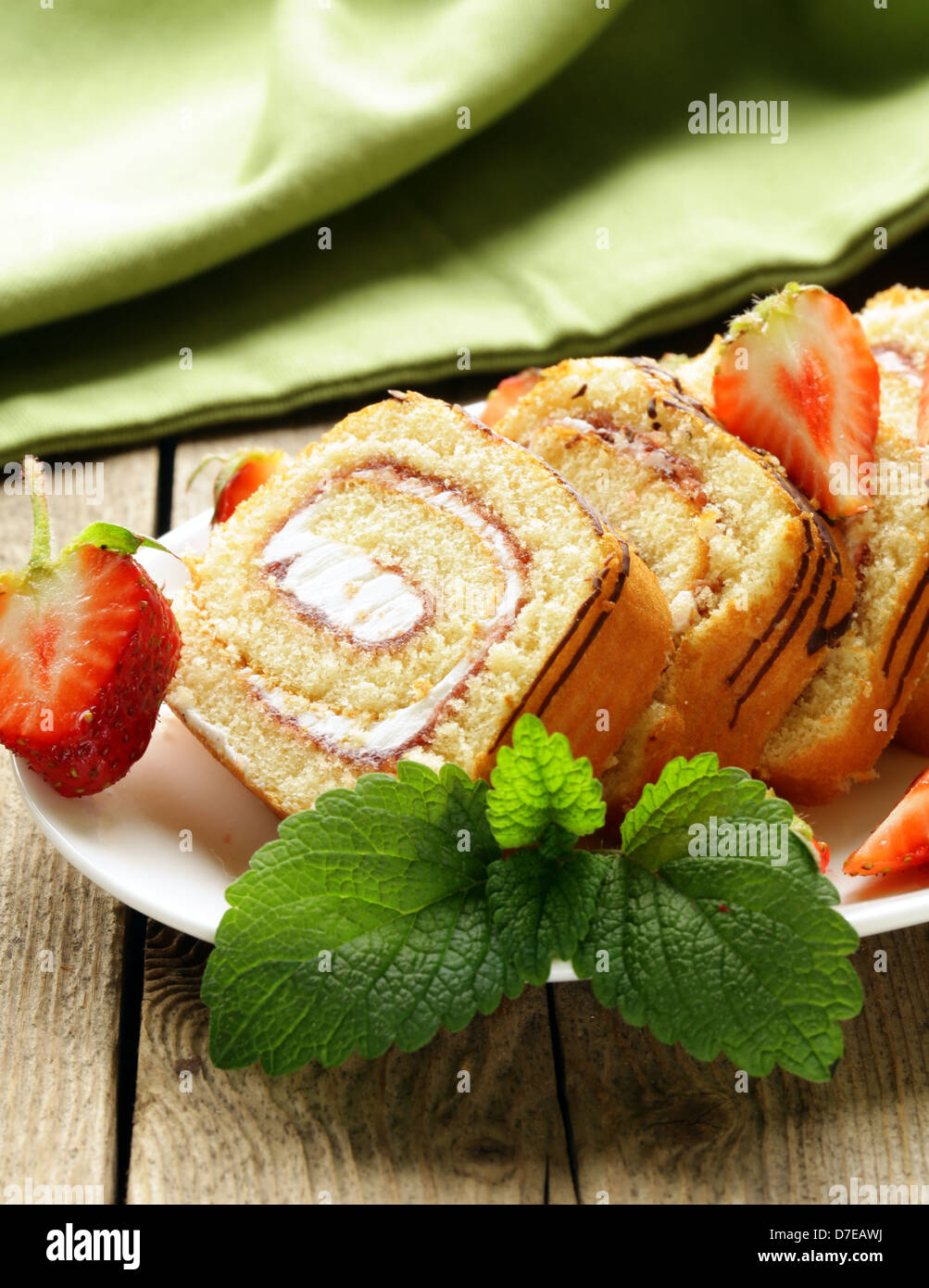 roulade cake with cream and fresh strawberries Stock Photo - Alamy
