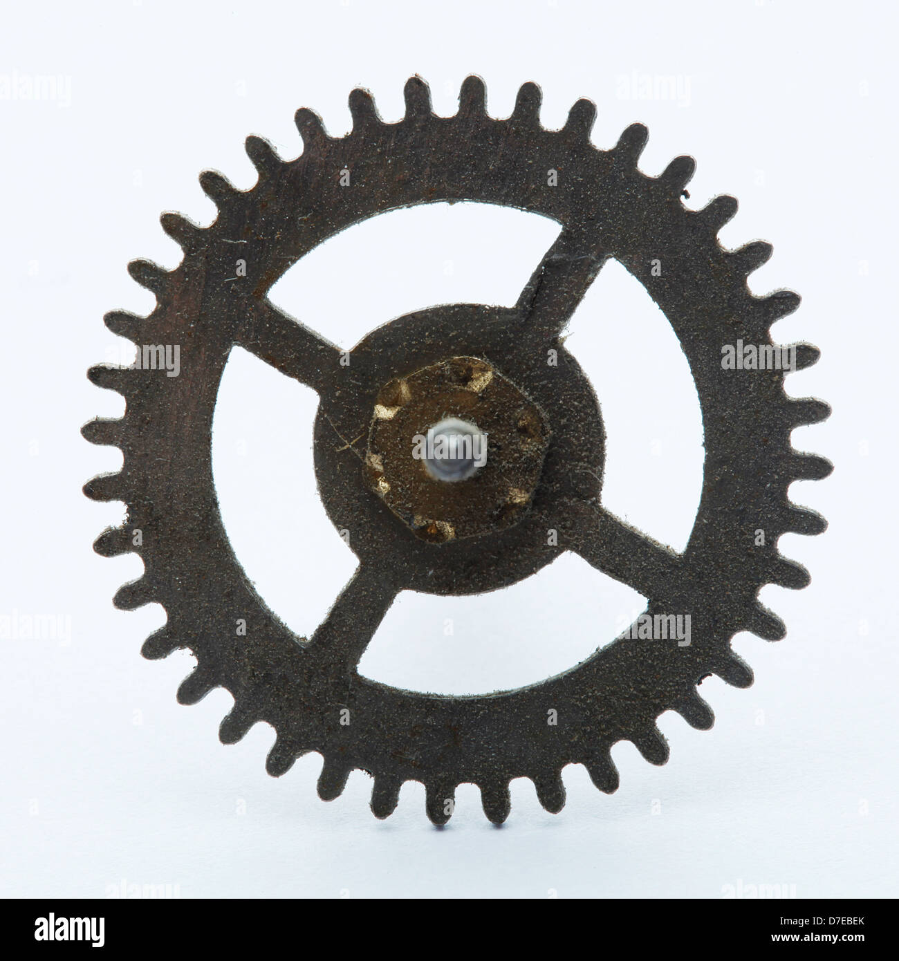 Cogwheel of clock on white background Stock Photo - Alamy