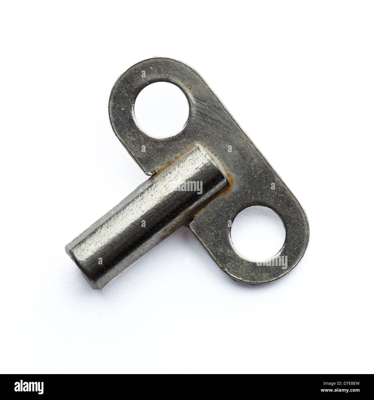 old clock key winder on white background Stock Photo - Alamy