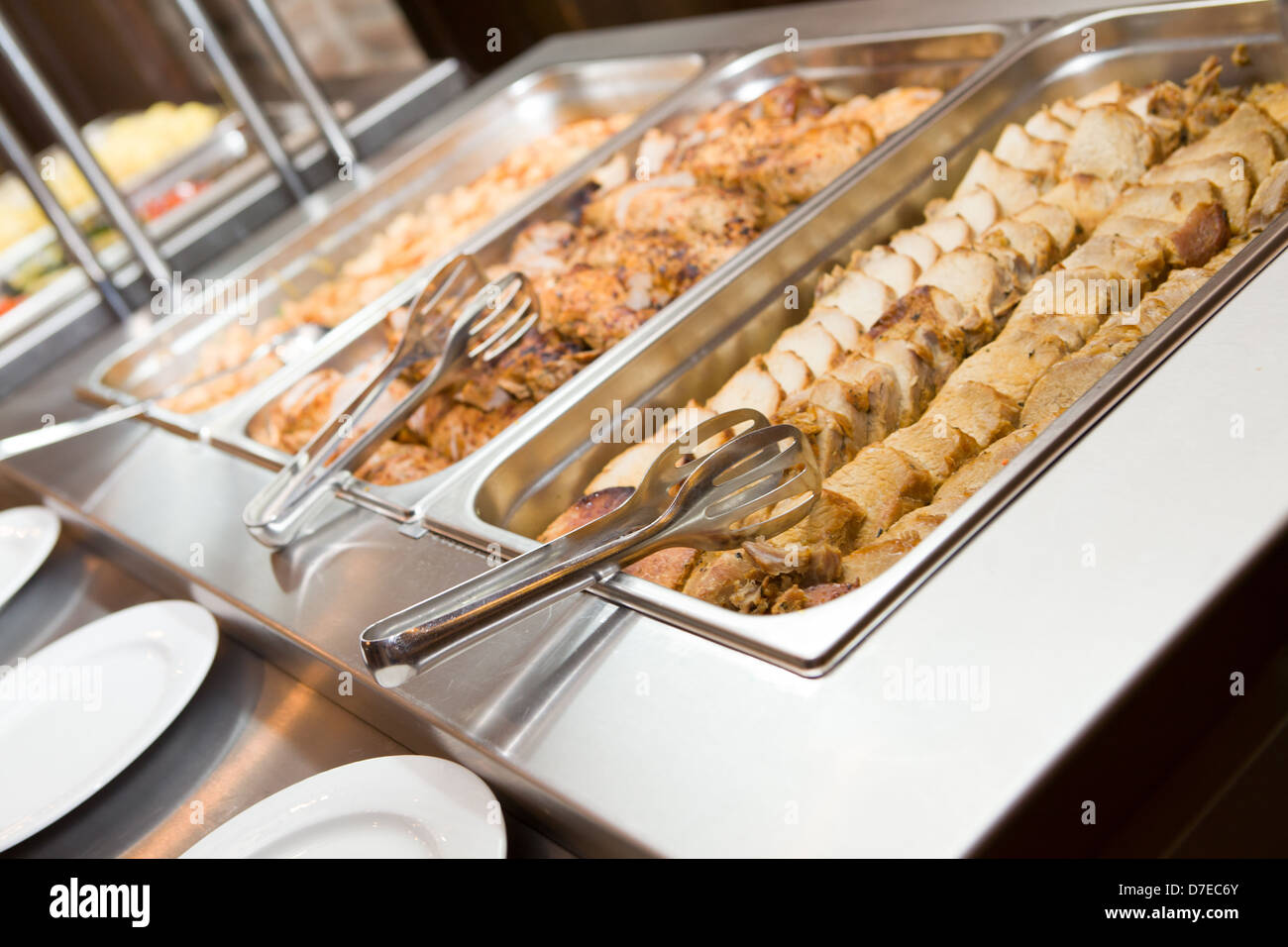 Meats and plates ready on a banquet Stock Photo - Alamy