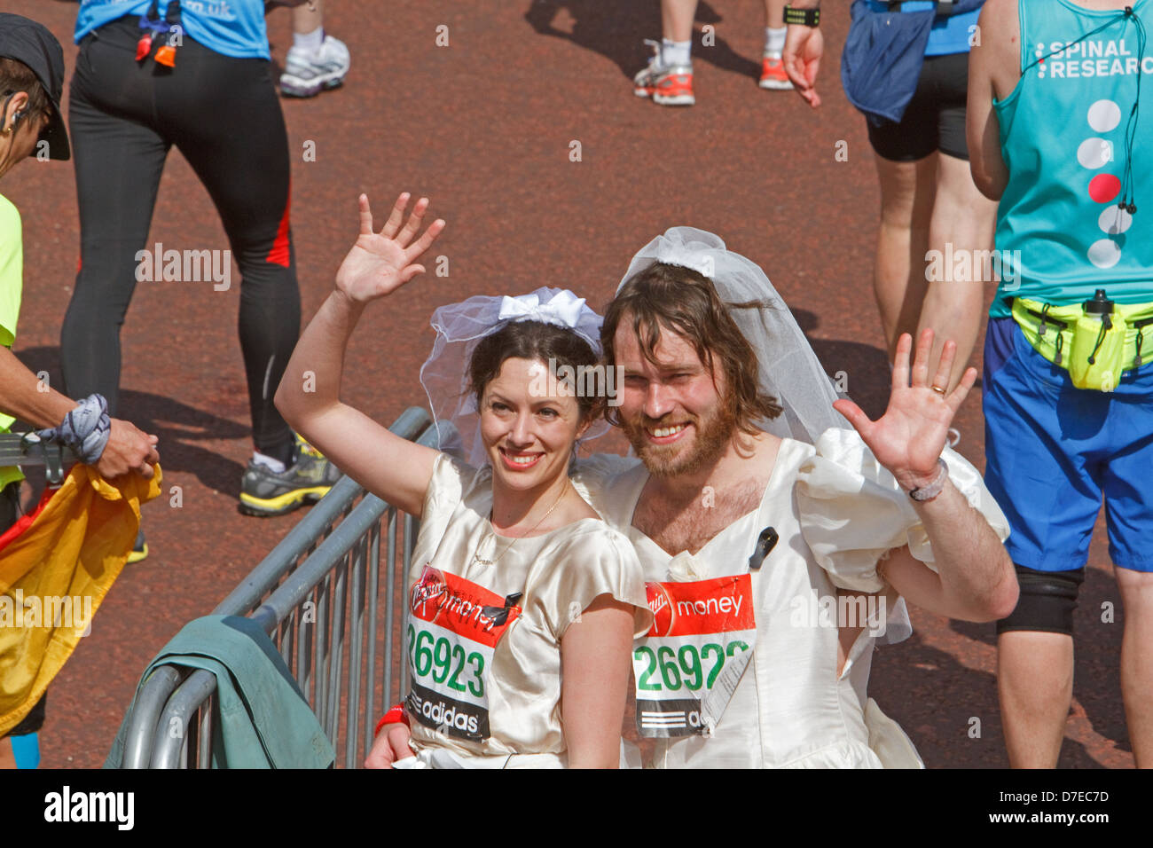 A married couple run the London Marathon dressed as Brides Stock Photo ...