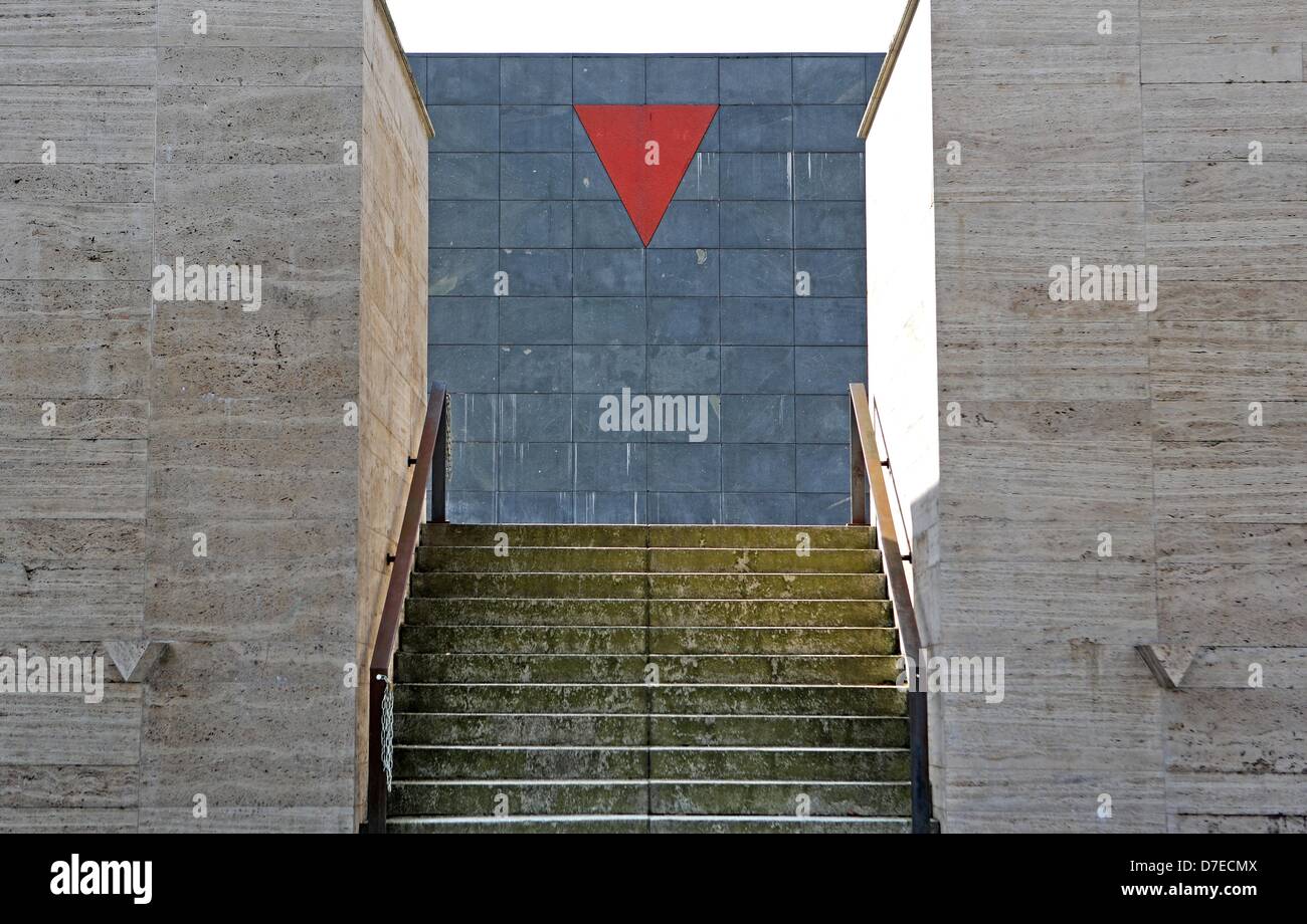 A red triangle is seen on the back of the memorial to the victims of ...