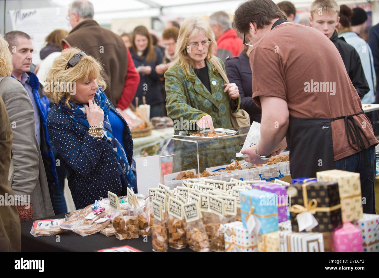 Visitors browsing stalls and sampling food at Exeter Festival of South ...