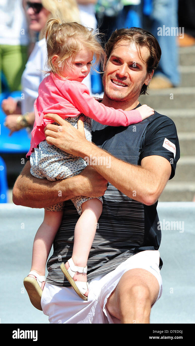 Tommy Haas of Germany holds his daughter Valentina after his victory ...