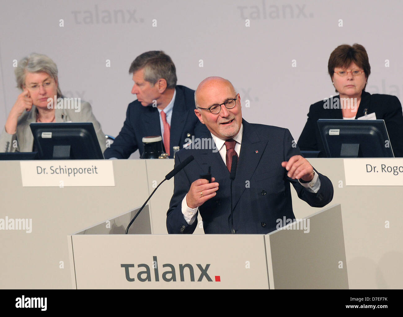 Talanx chairman of the management board Herbert Haas (front) speaks ...